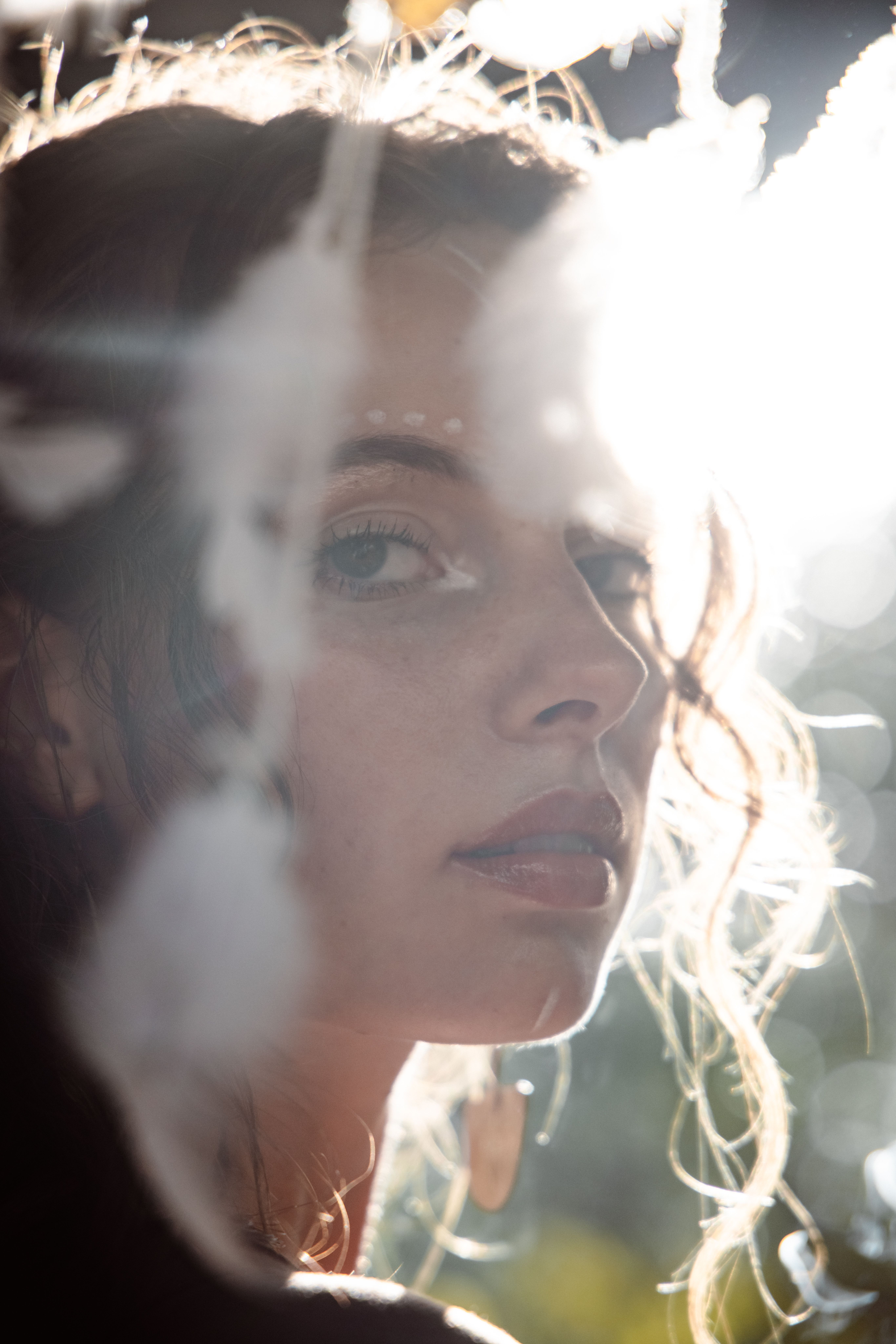 A Beautiful Woman with Makeup Looking Back · Free Stock Photo