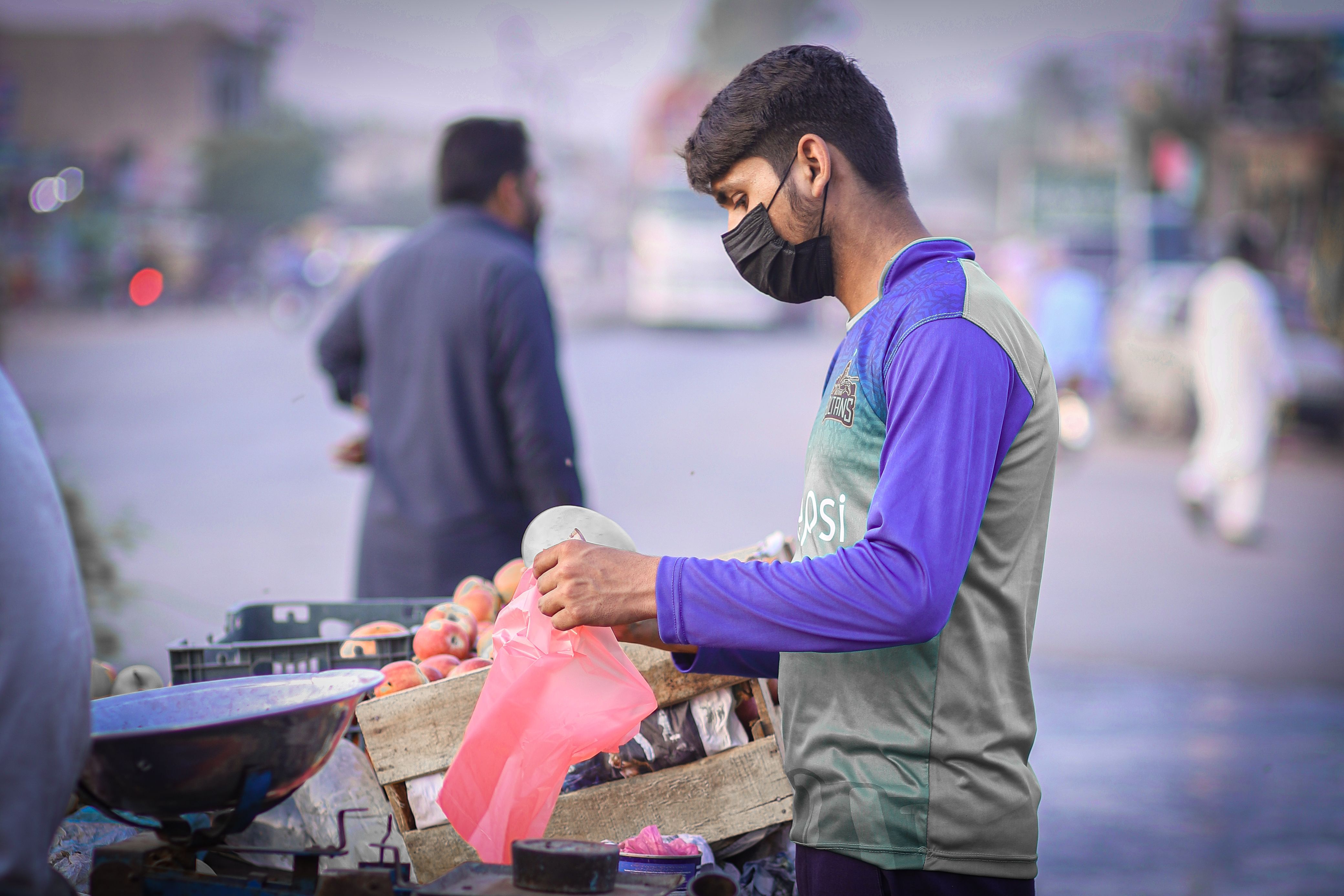 A Man Selling Fruits on the Street · Free Stock Photo