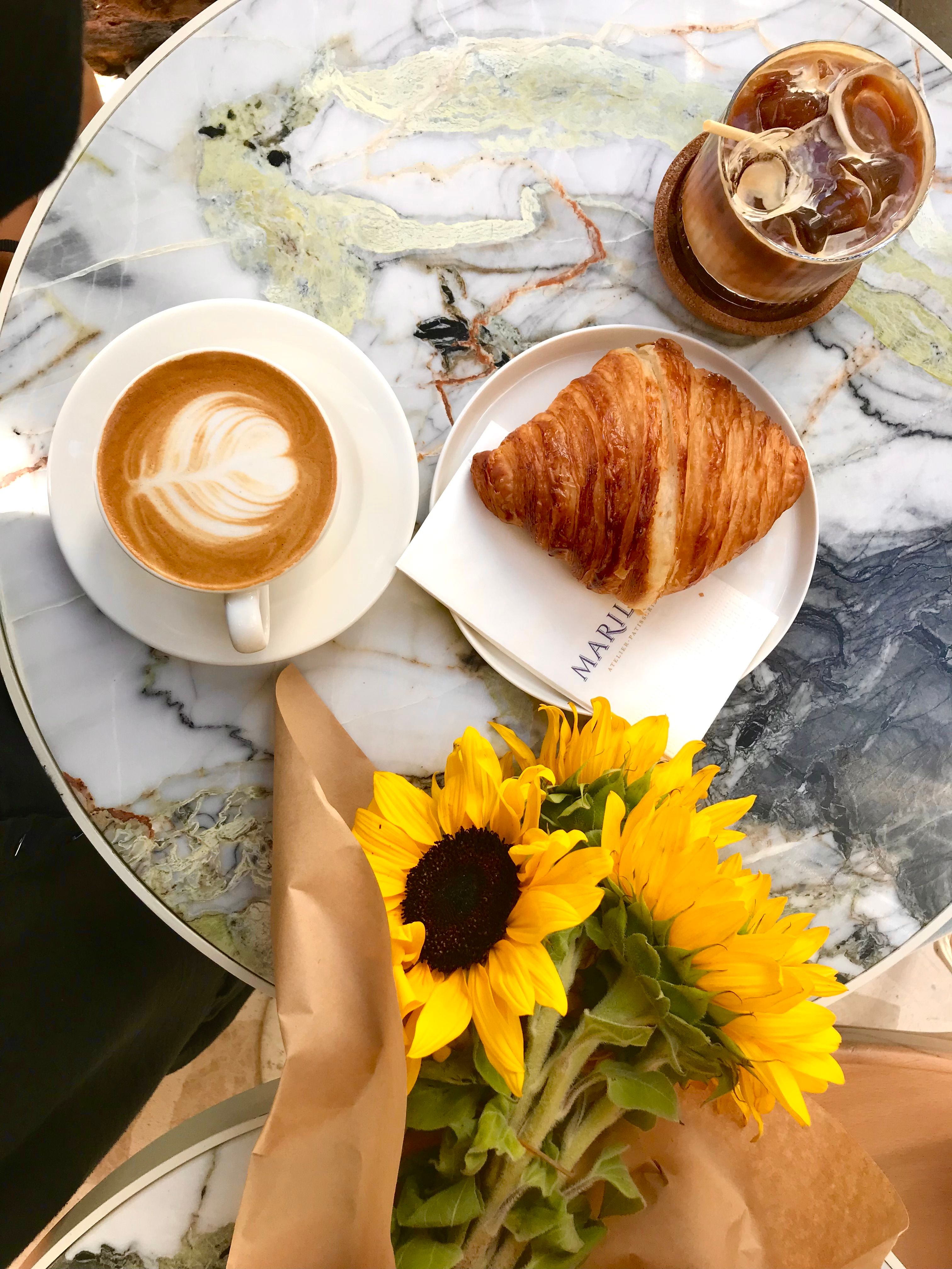Croissants and Latte on Top of a Marble Table · Free Stock Photo
