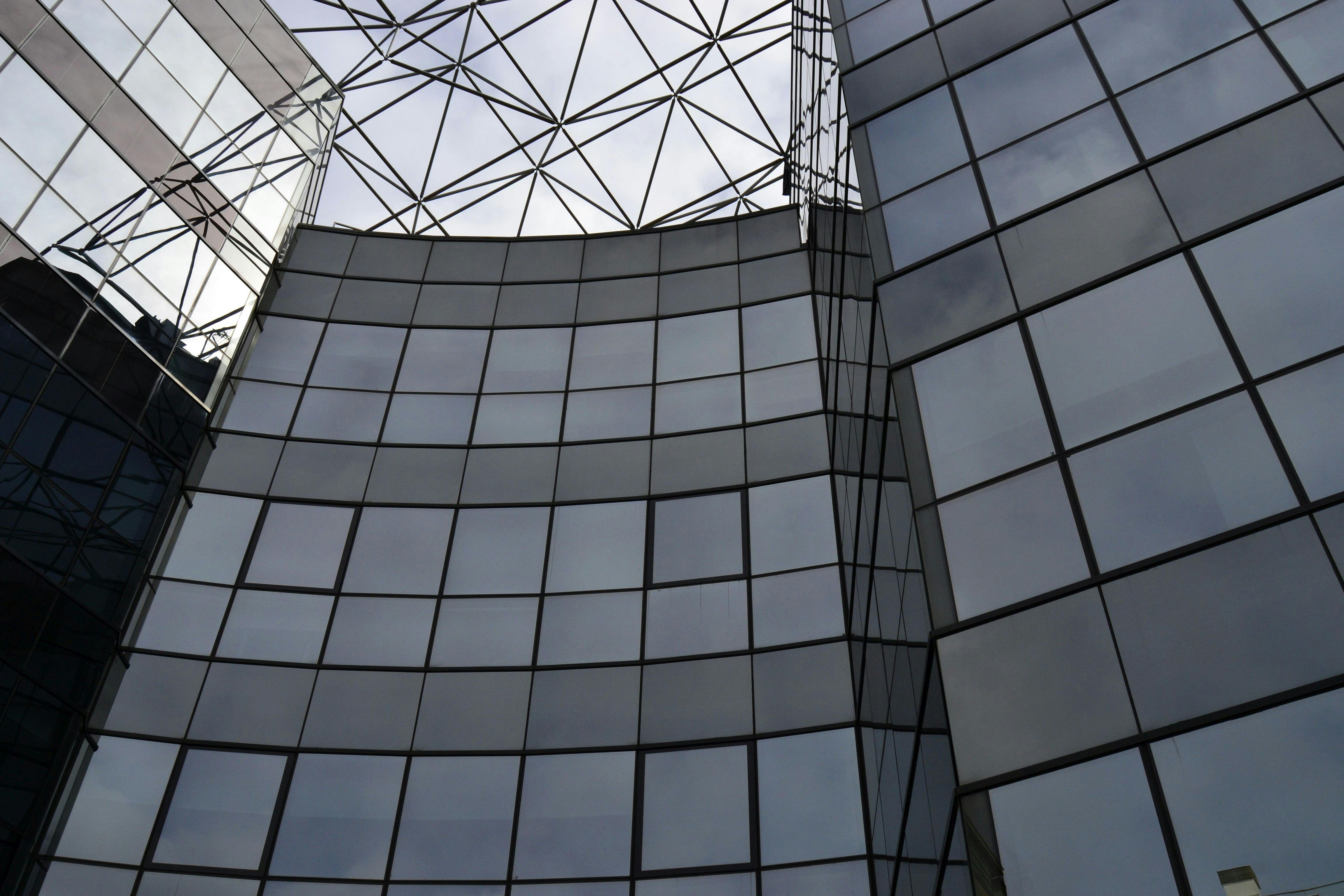 Low Angle Shot of a Glass Building · Free Stock Photo