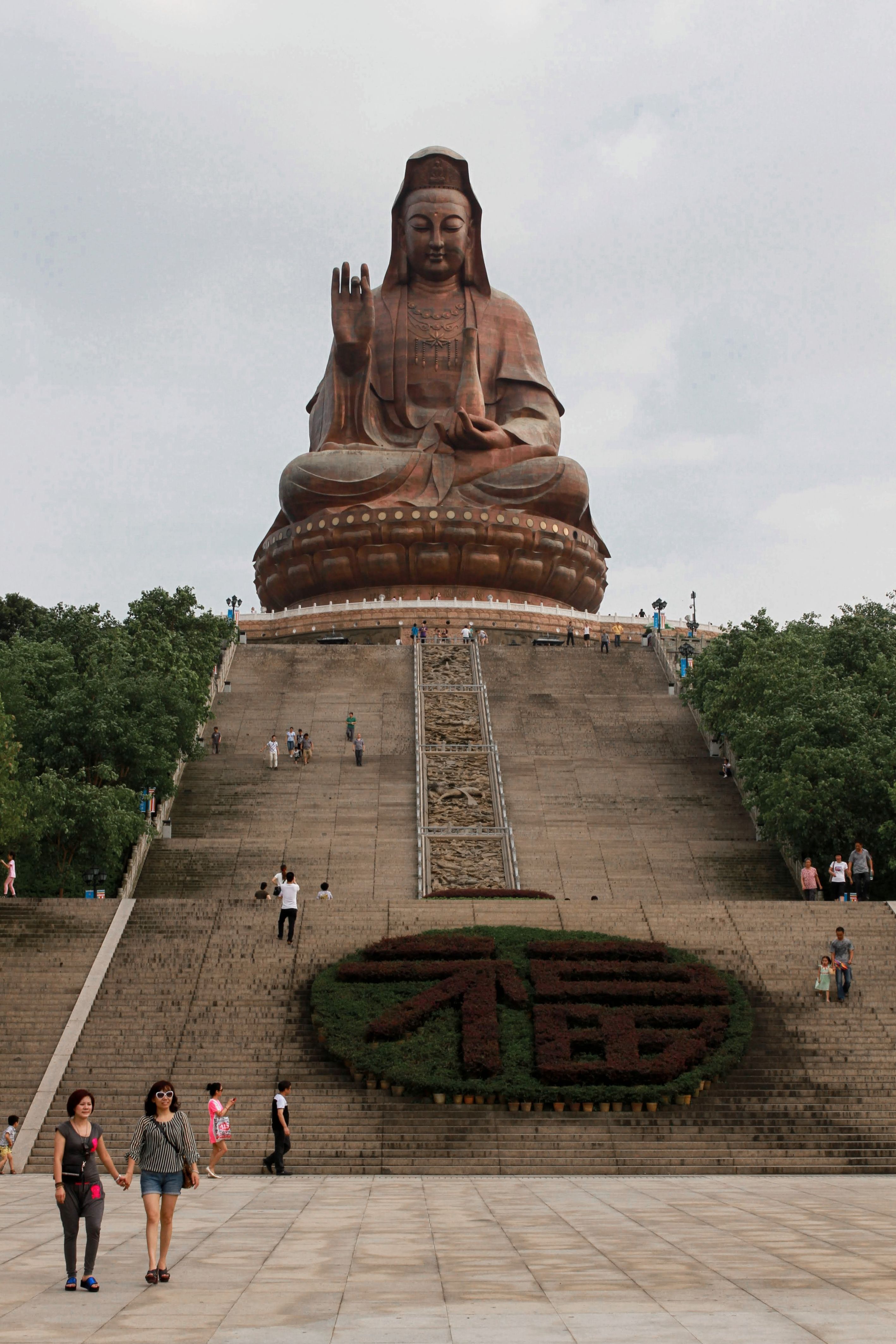 Brown Concrete Statue Under White Sky · Free Stock Photo