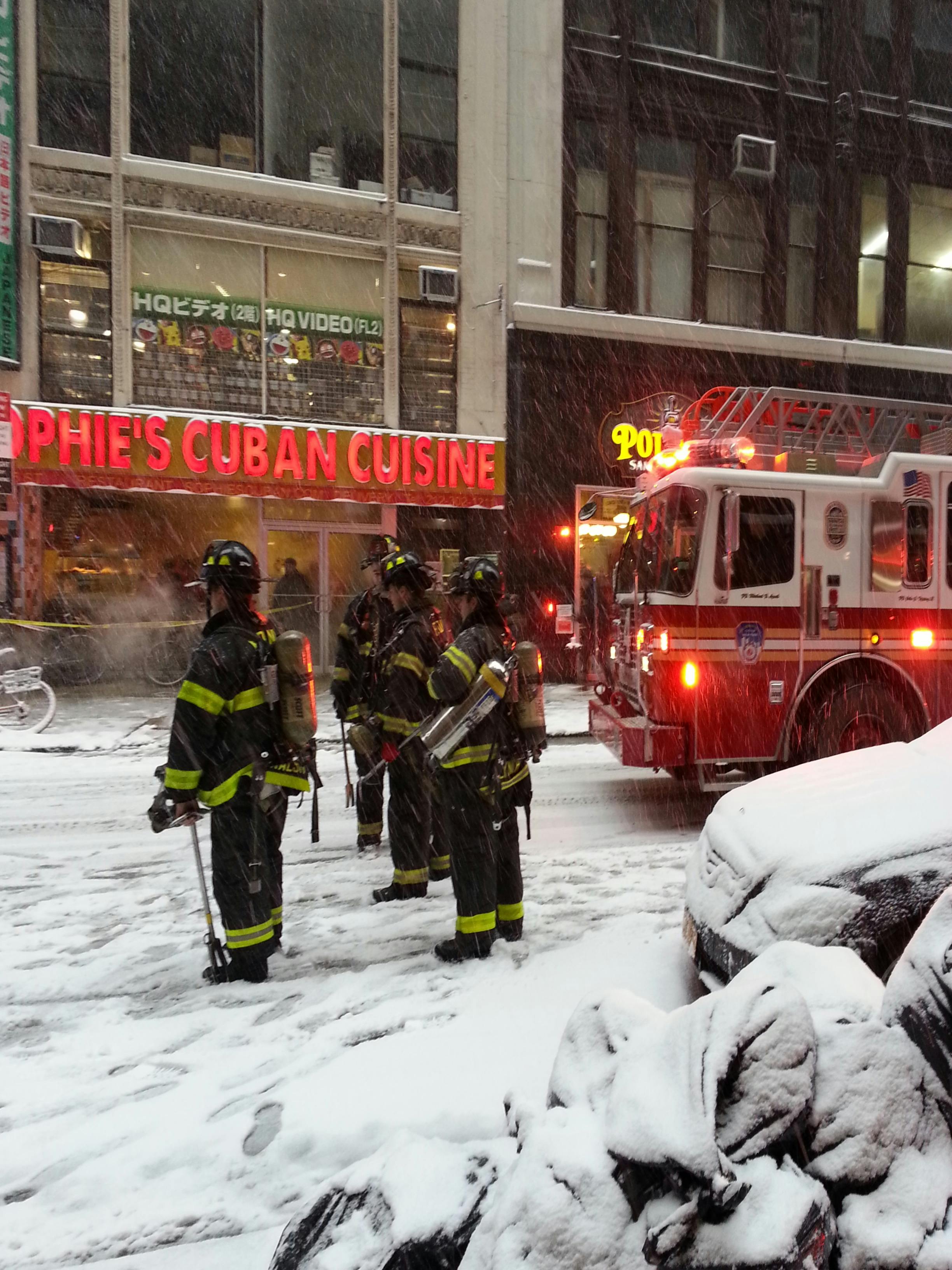Firefighters standing on a Snow Covered Land · Free Stock Photo