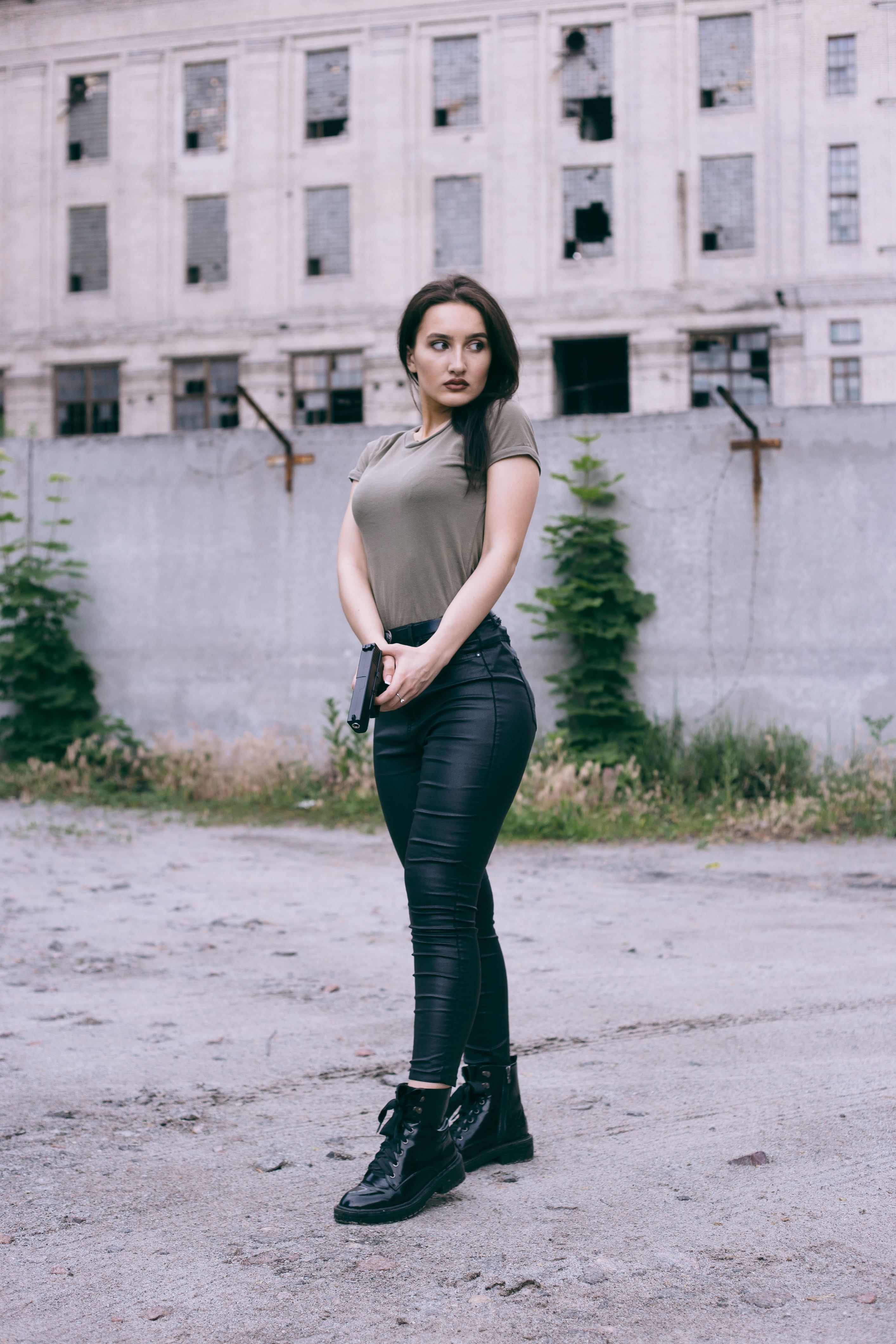 Woman Holding an Ammunition Magazine and Gun · Free Stock Photo
