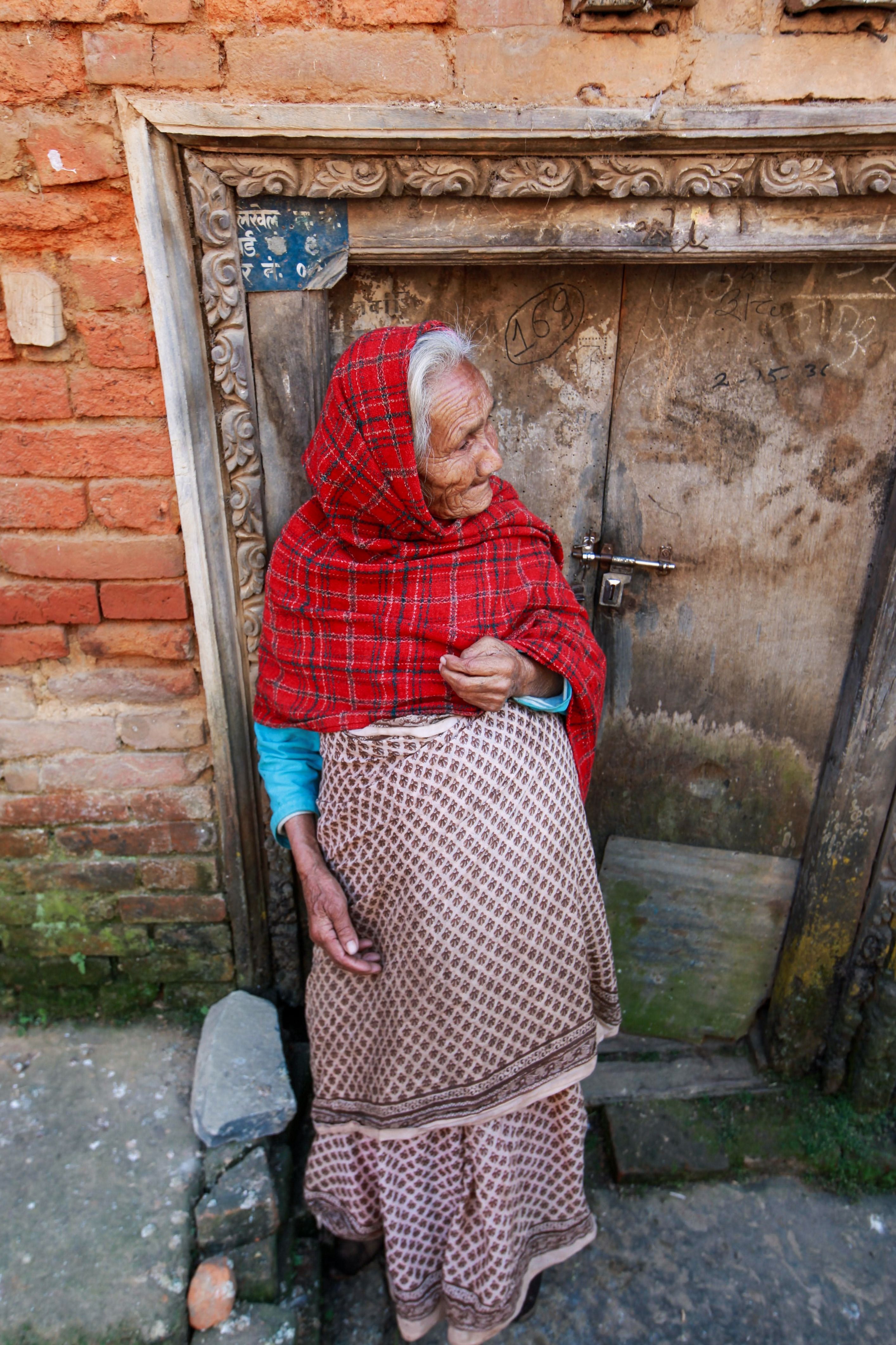 Elderly Women Posing by Doorway to Hut · Free Stock Photo