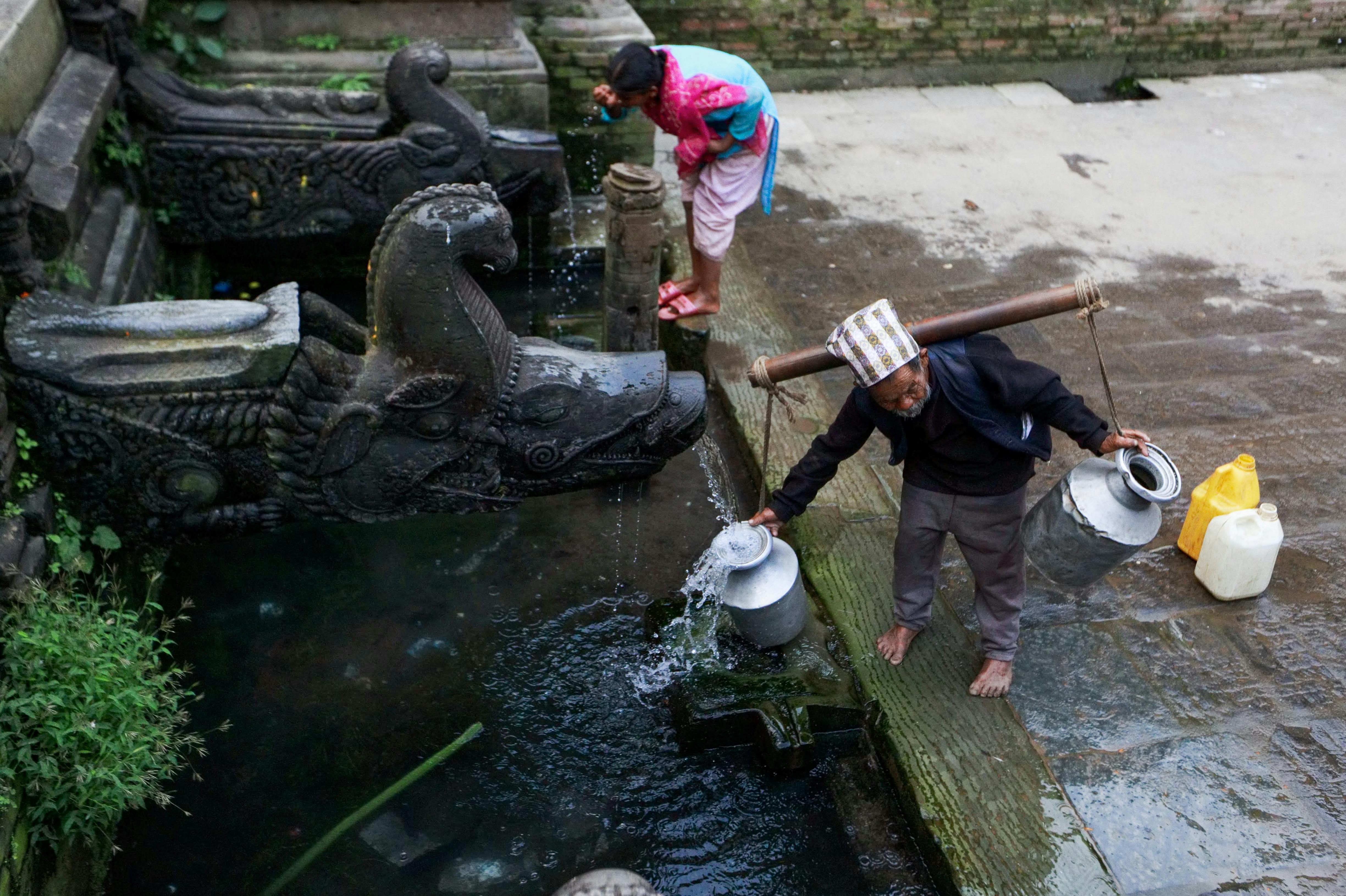 A Woman Fetching Water From Well · Free Stock Photo