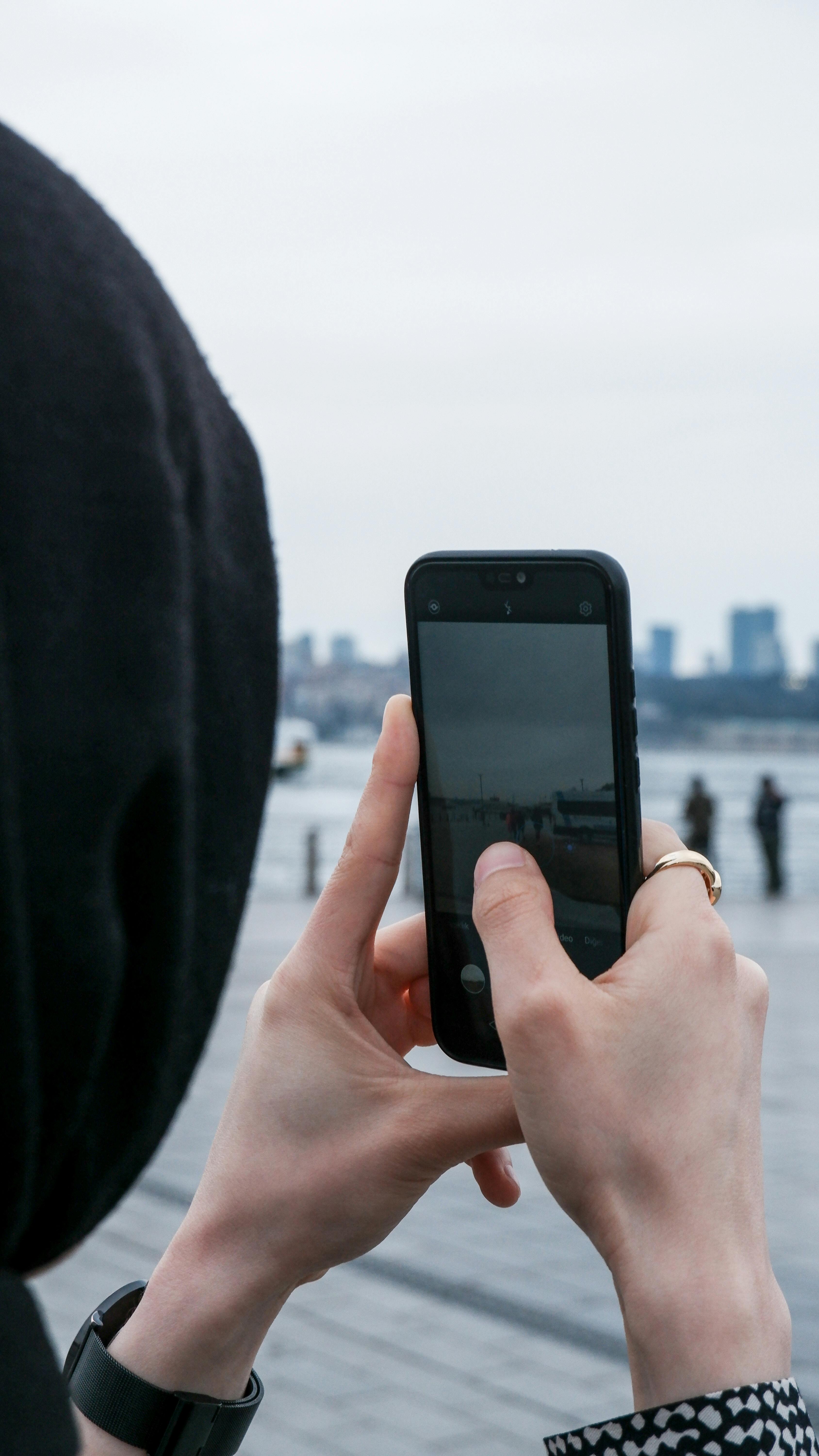 Person Holding Iphone · Free Stock Photo