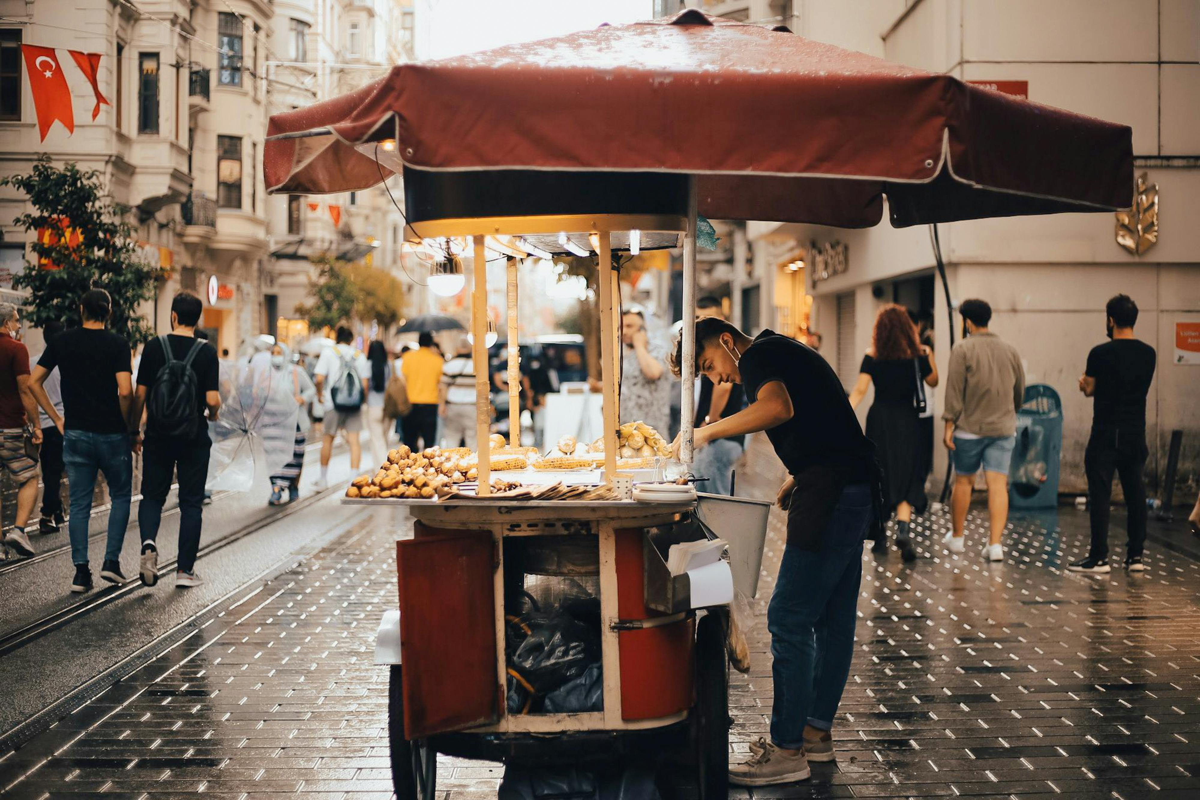 Men Pushing a Fully Loaded Cart on a City Street · Free Stock Photo