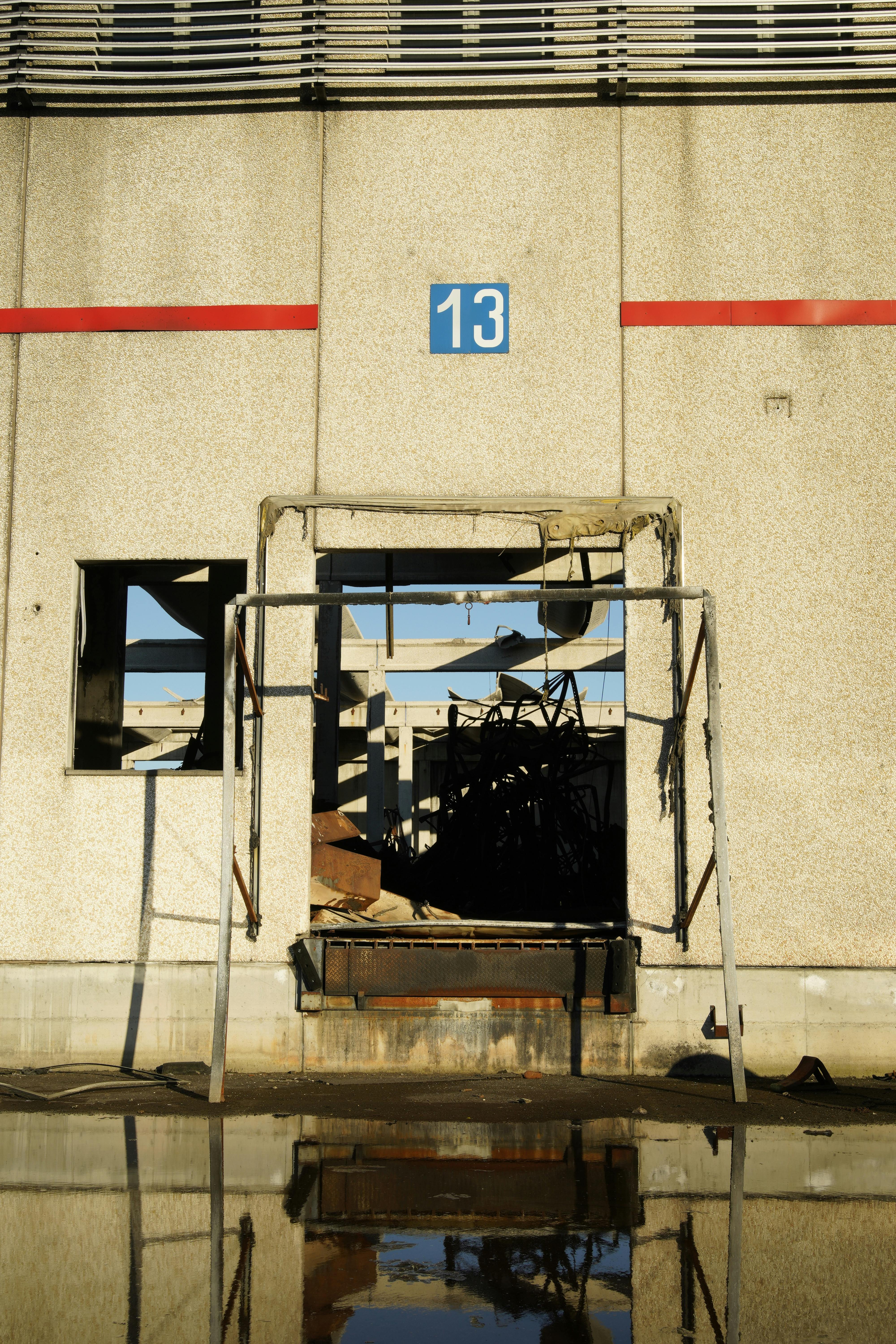 Reflection of Destroyed Window in Water · Free Stock Photo