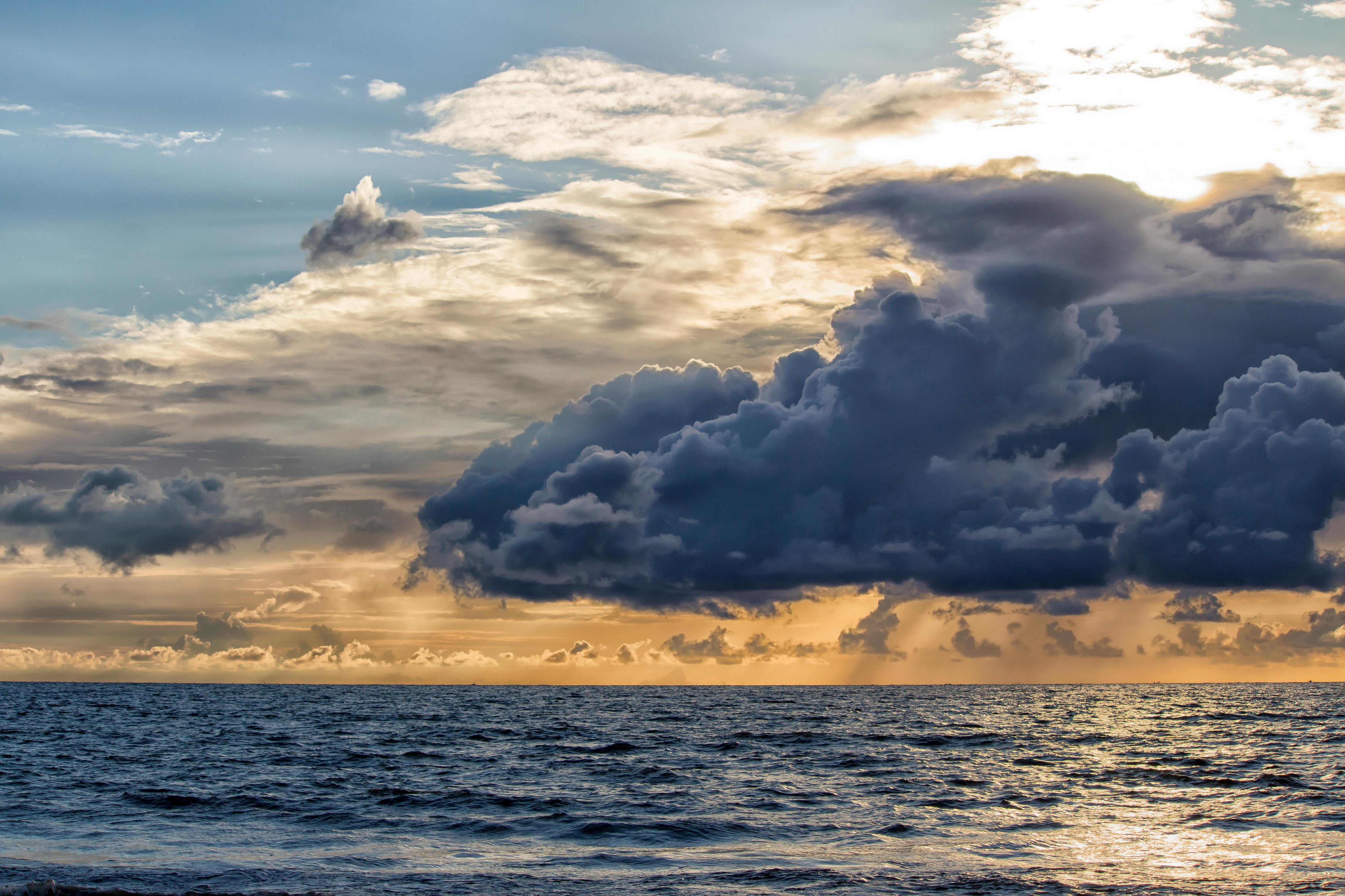 Pier in Sea under Dramatic Sky at Sunset · Free Stock Photo