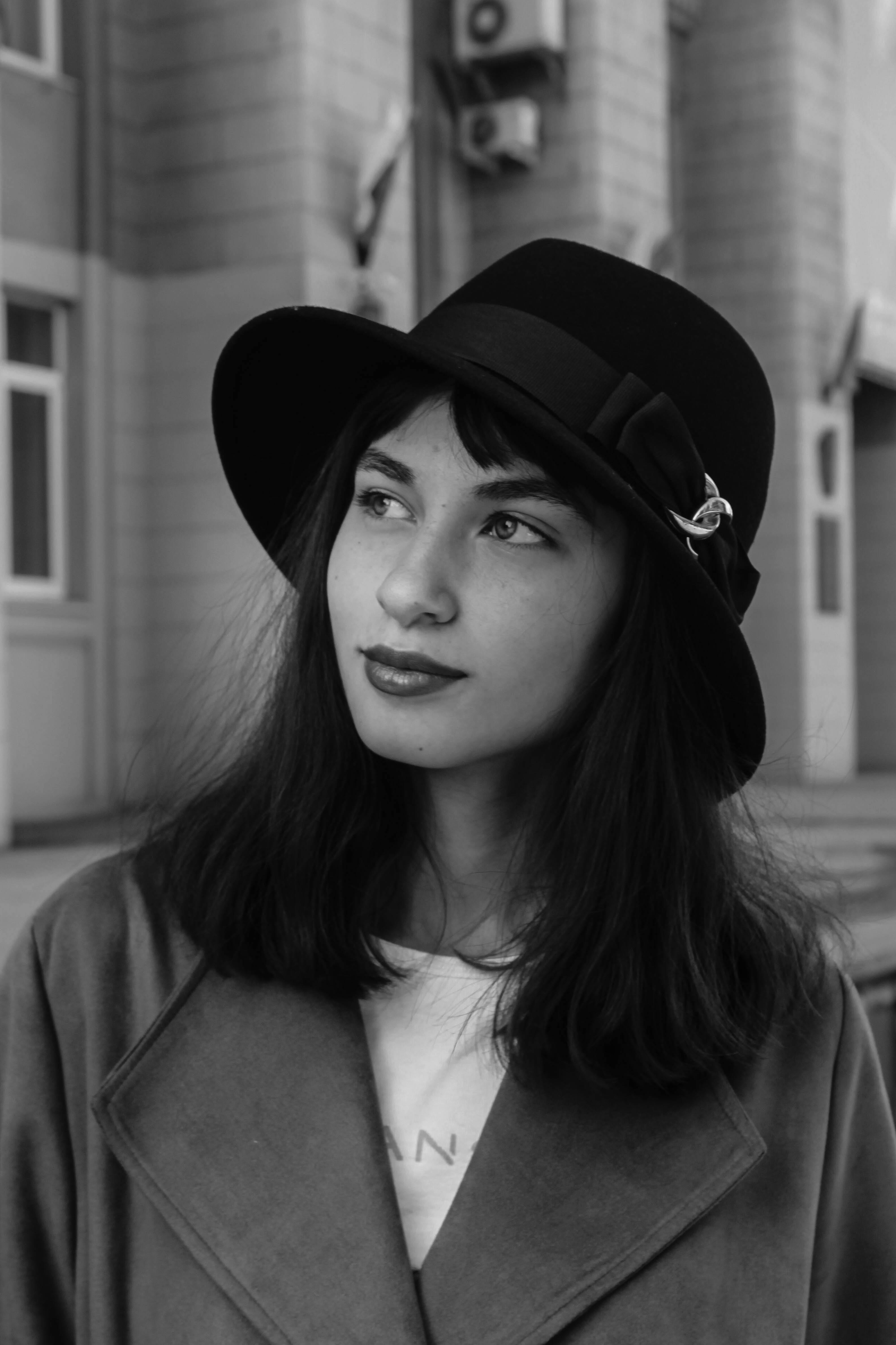 A Woman in a Coat Praying · Free Stock Photo