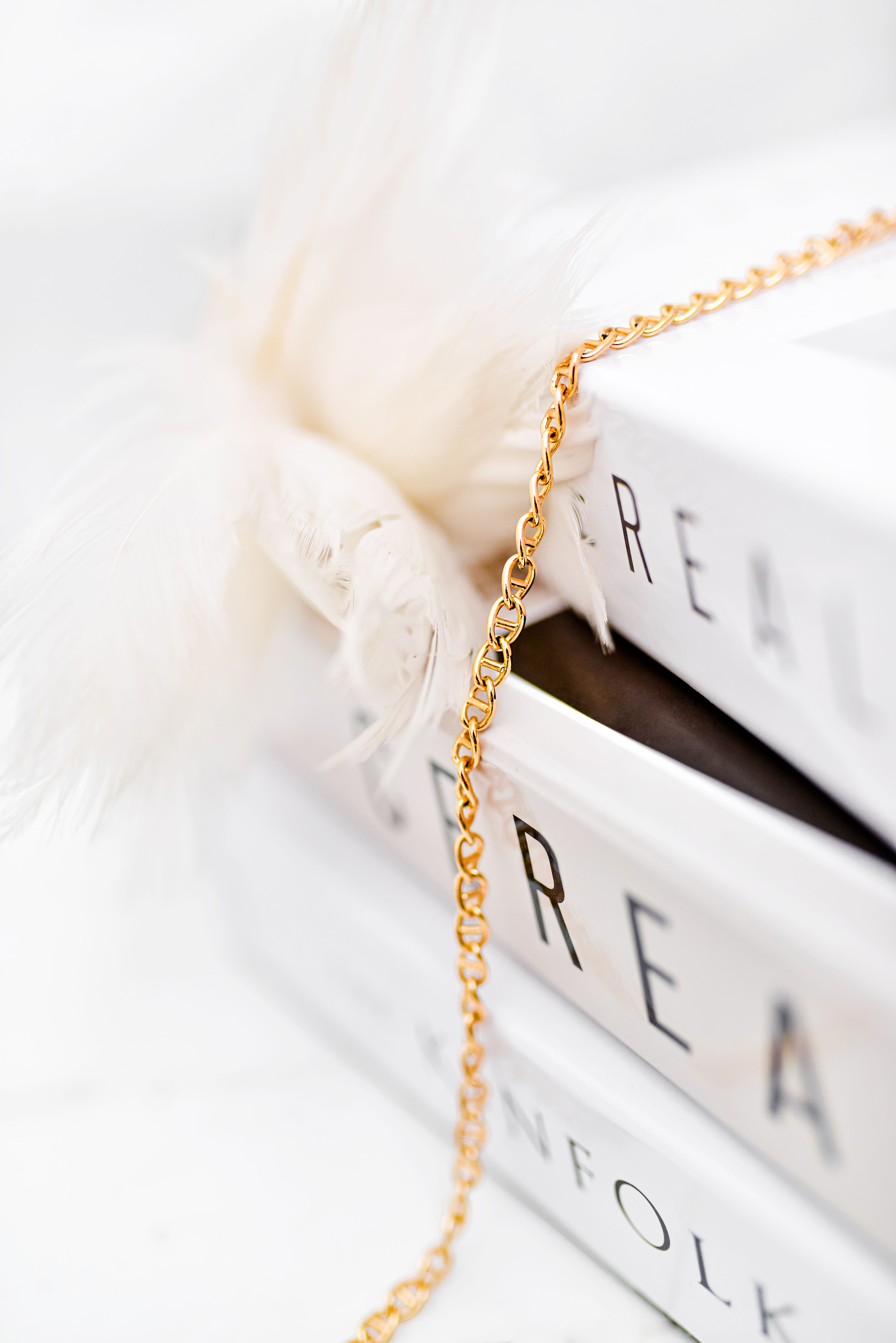 Gold Chain on a Pile of Books · Free Stock Photo
