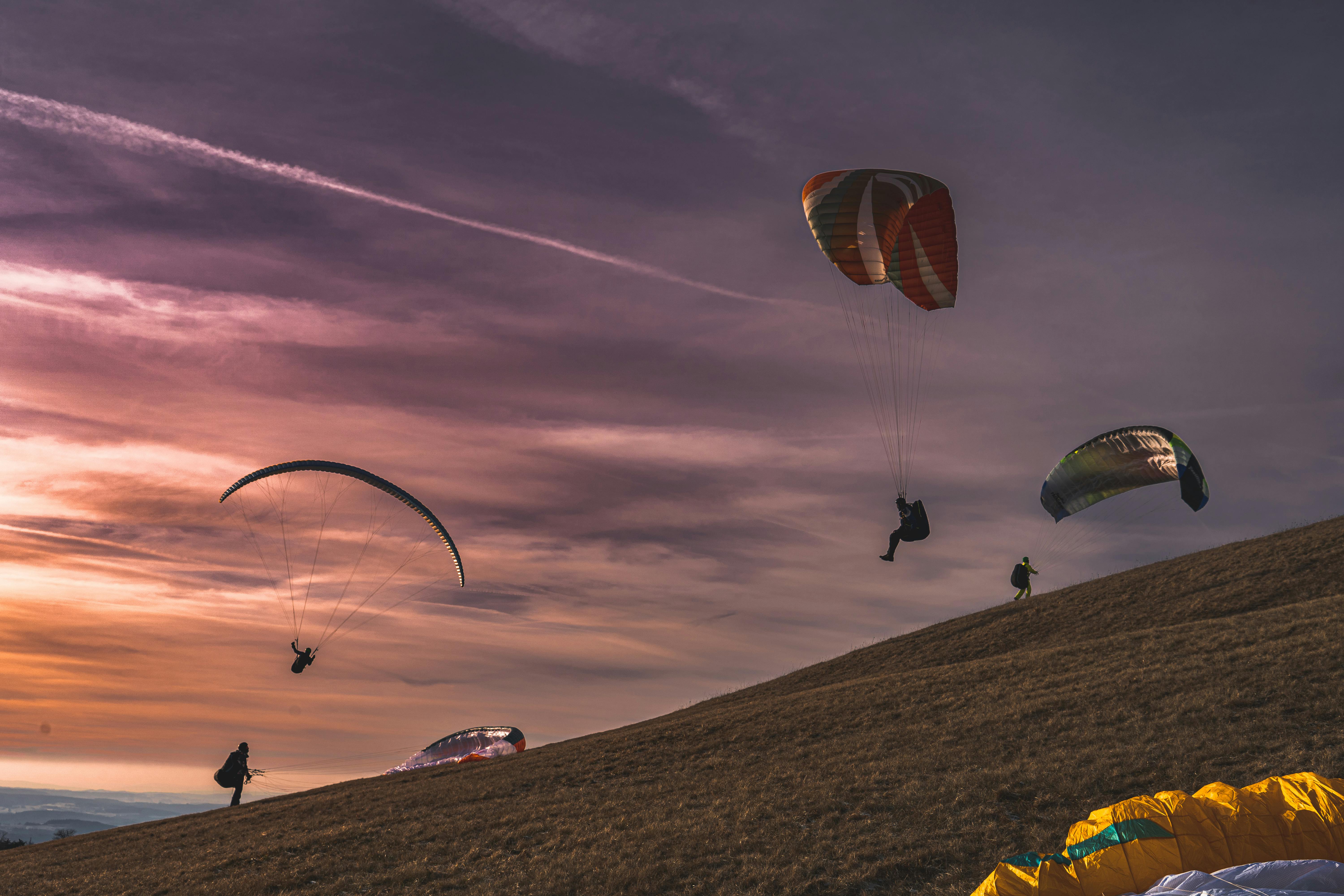 People Parachuting at Sunset · Free Stock Photo
