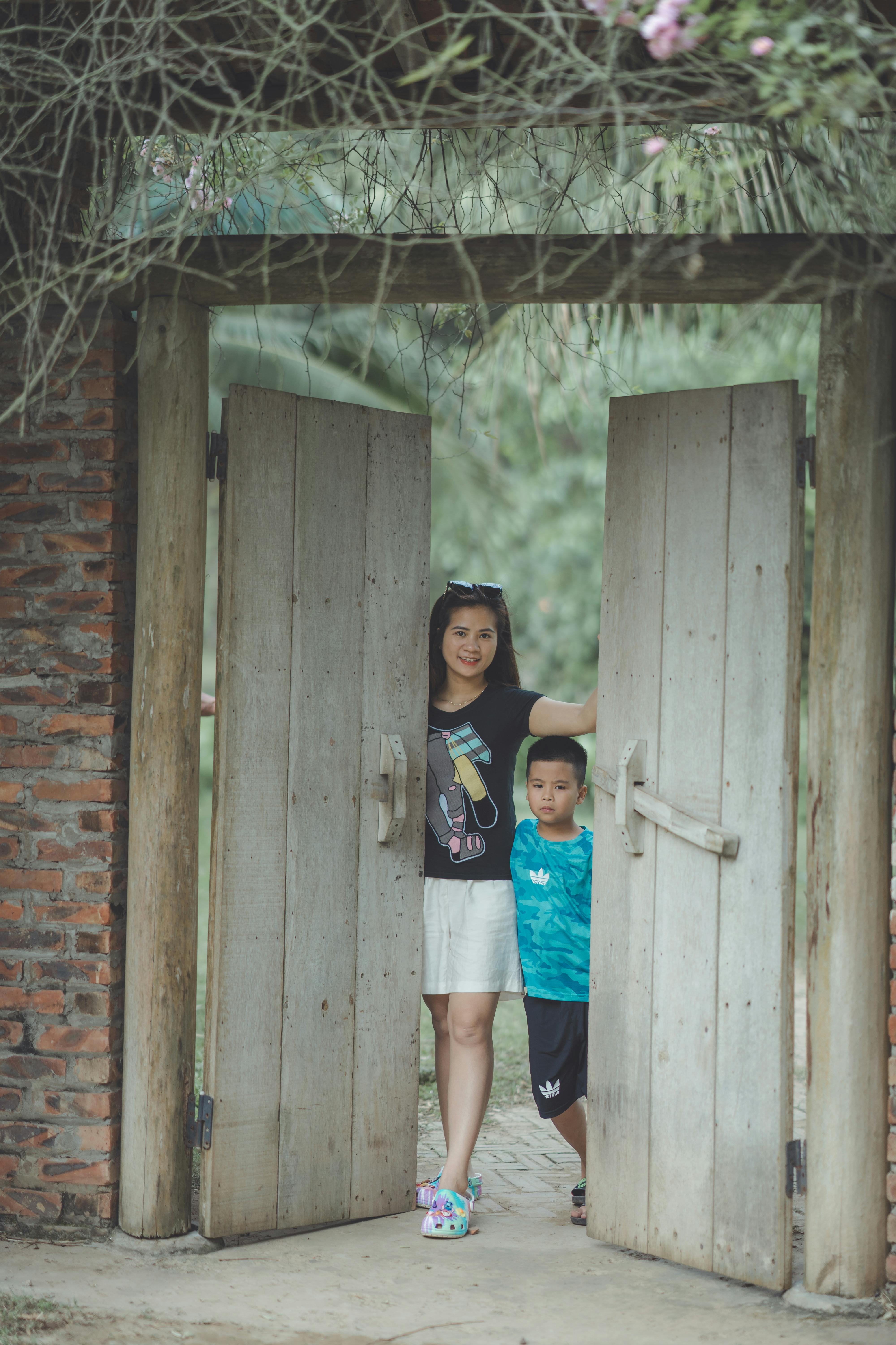 Group of Happy People Sitting on a Pavement · Free Stock Photo