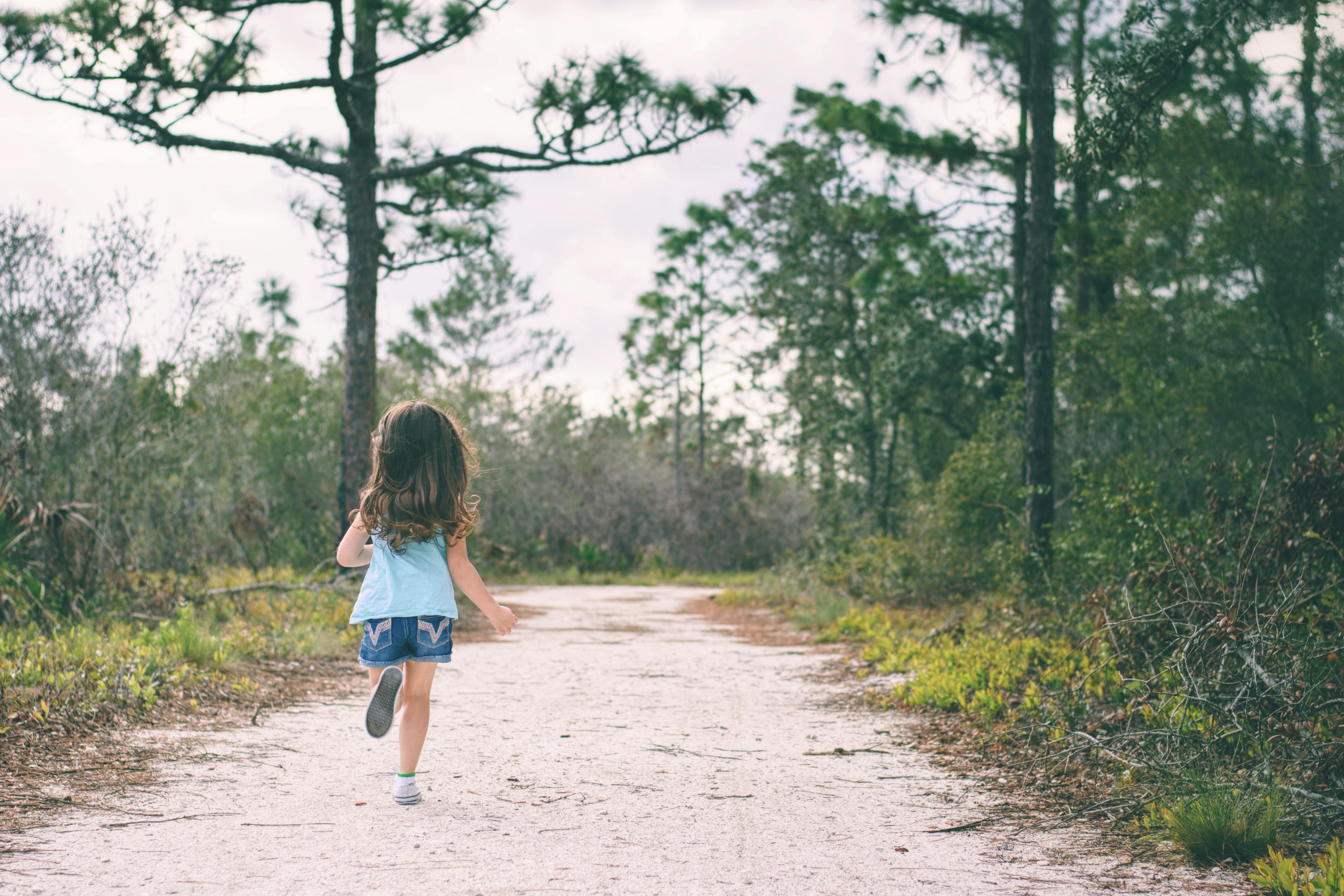 Girl Running on Dirt Road · Free Stock Photo