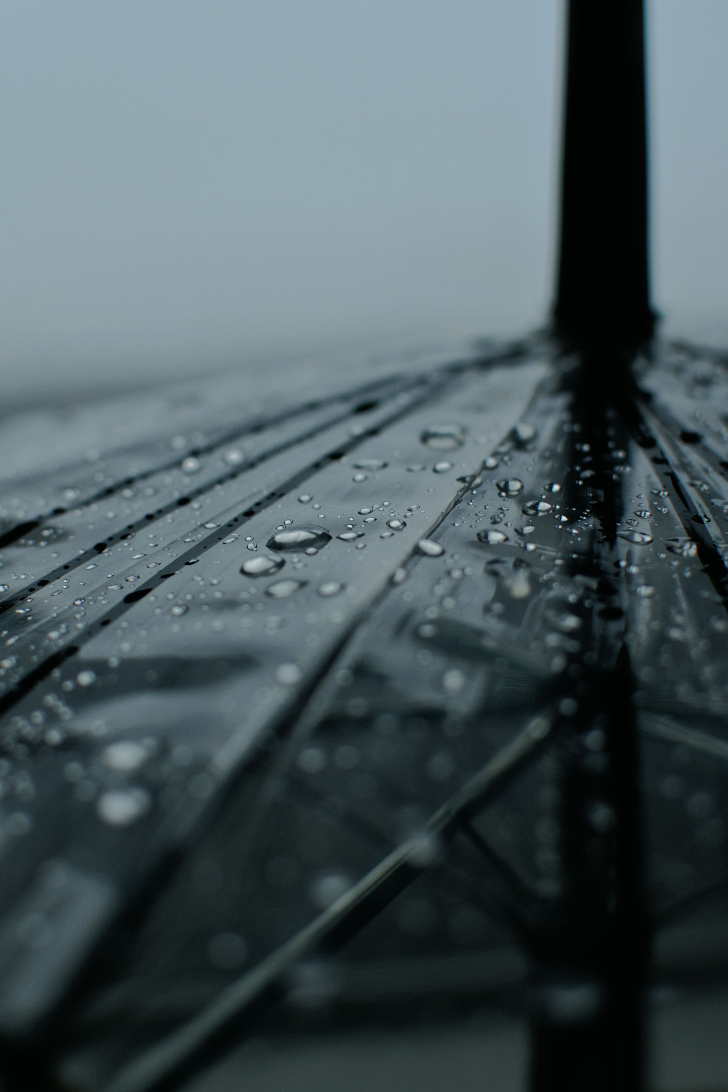 Woman behind Window Pane in Rain Droplets · Free Stock Photo