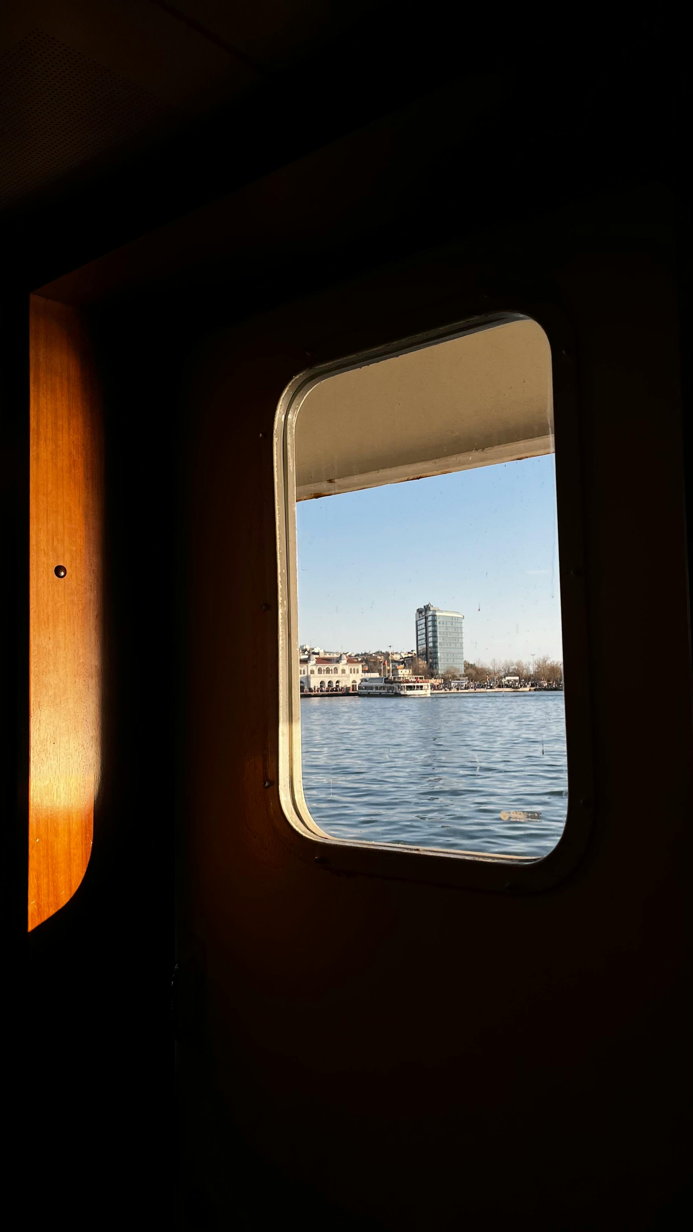 Sea behind Vessel Window · Free Stock Photo