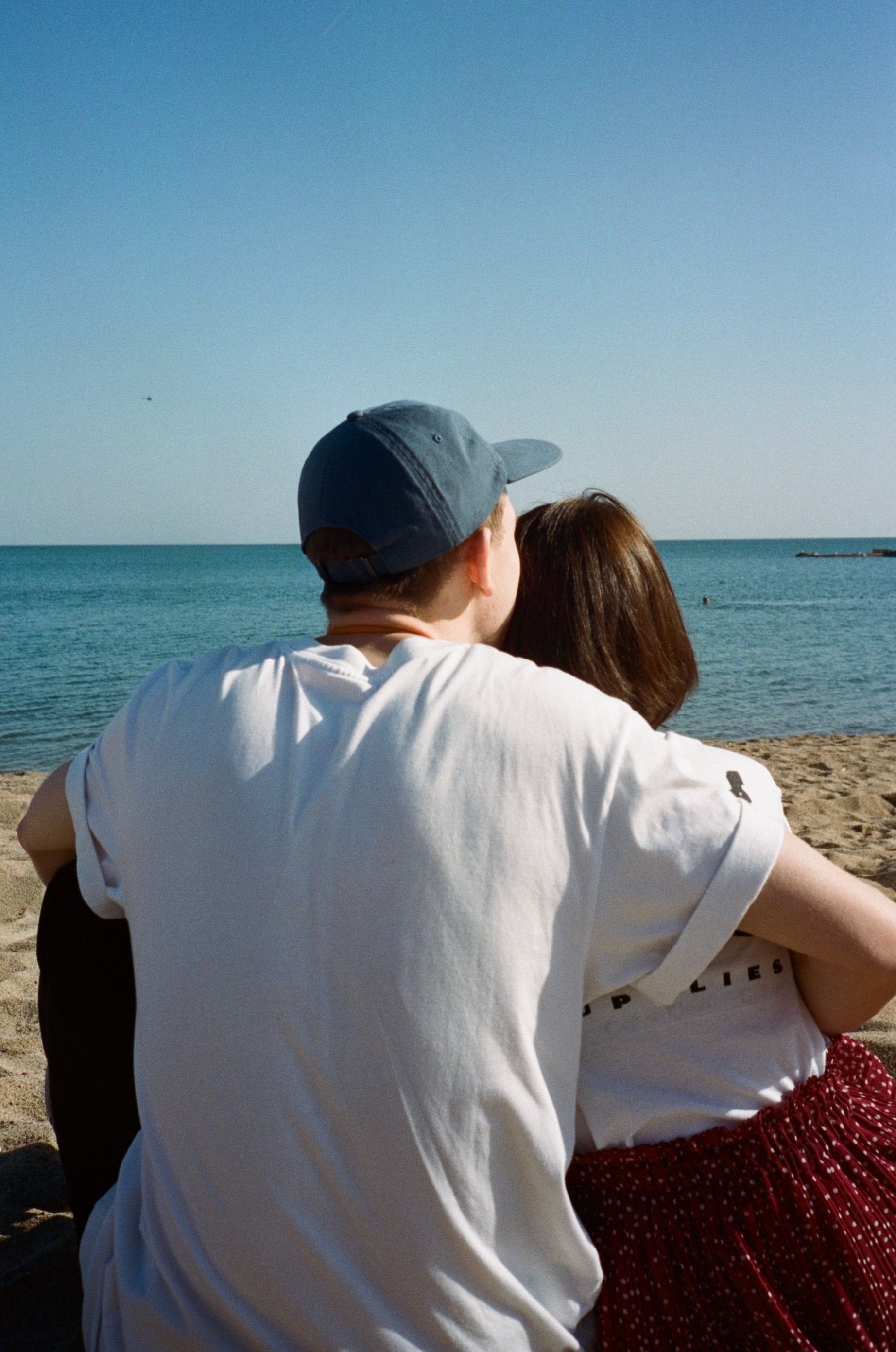 Back View of Couple Hugging at Beach · Free Stock Photo