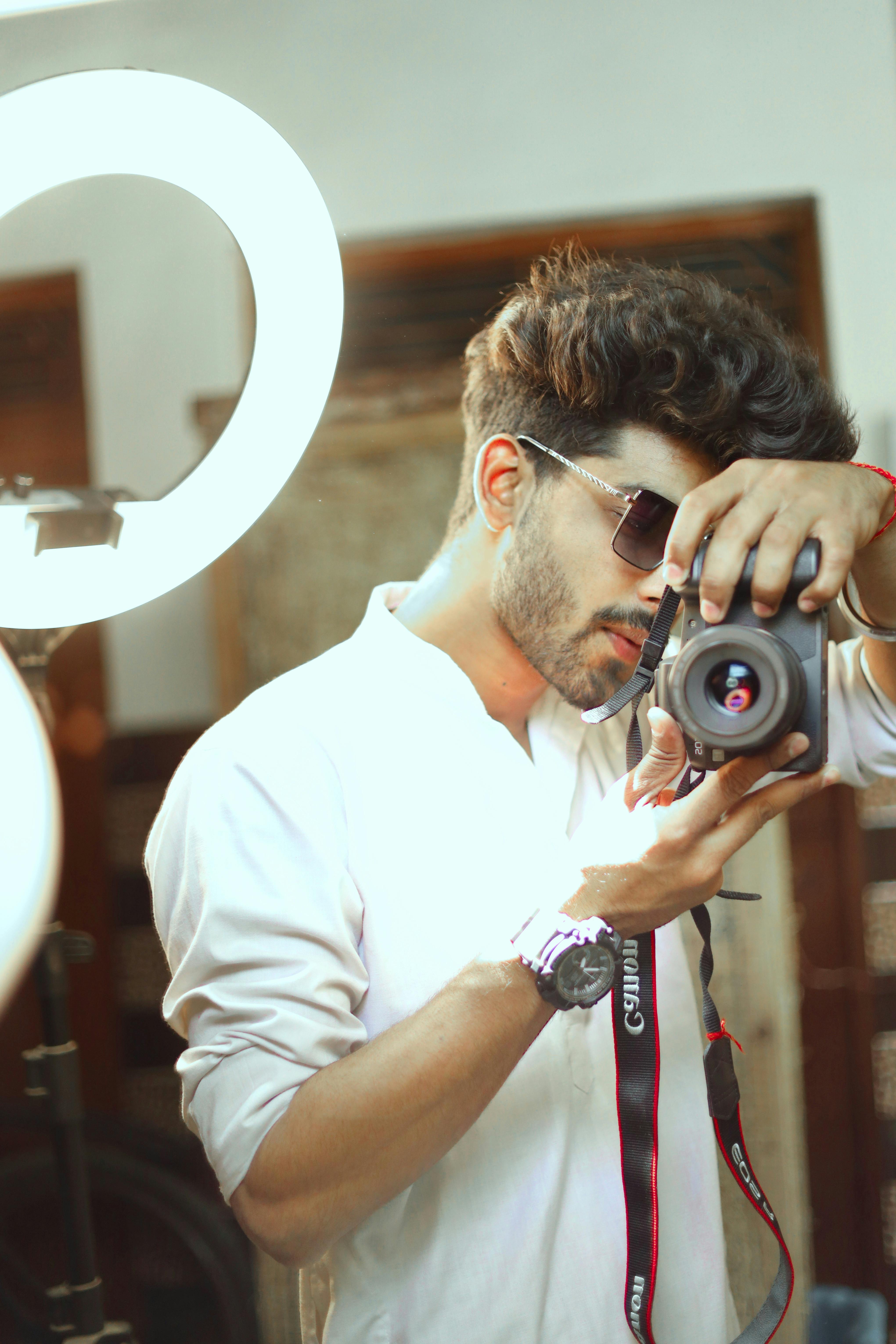 Man Holding Camera · Free Stock Photo