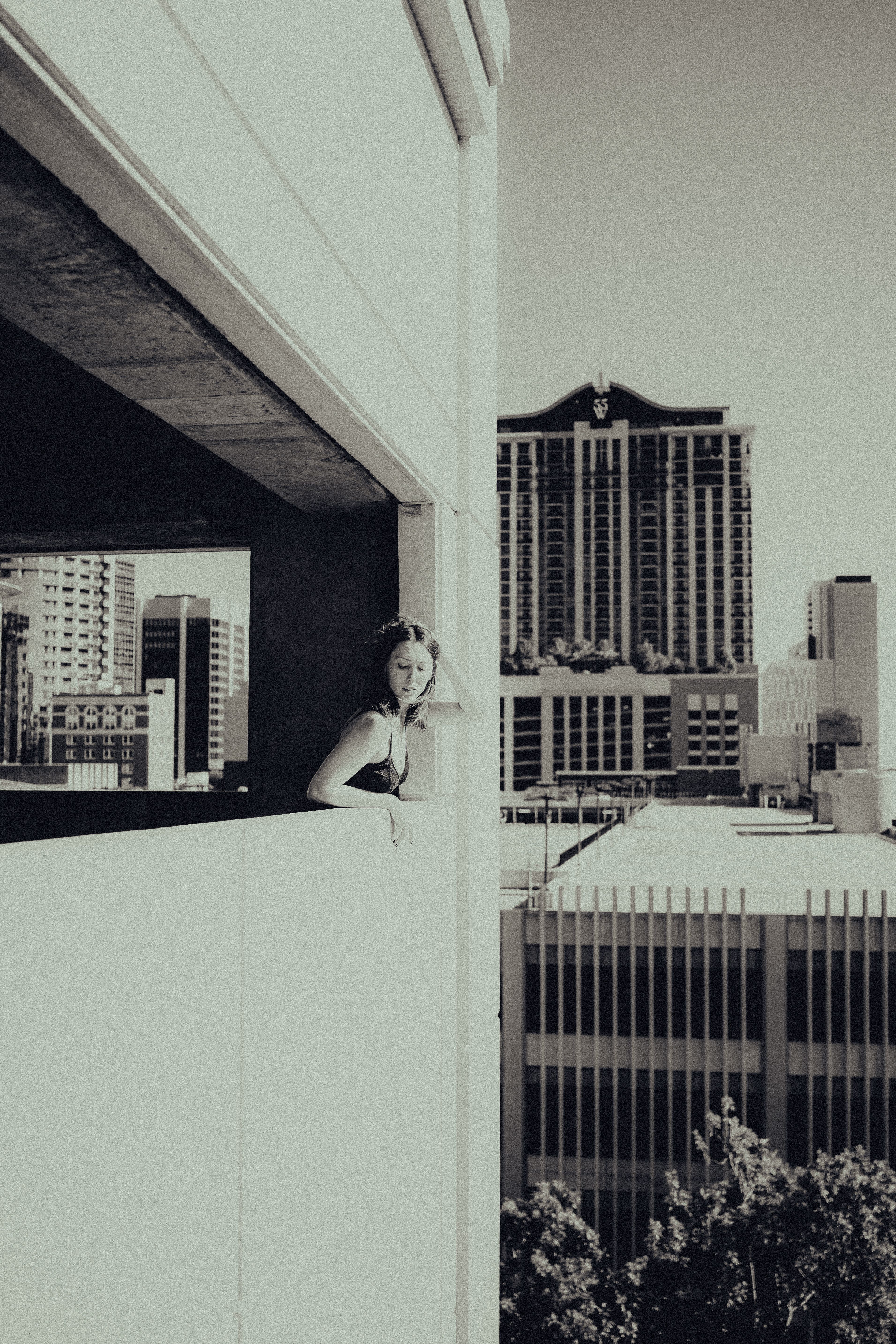 Woman Leaning Out of Window in City · Free Stock Photo