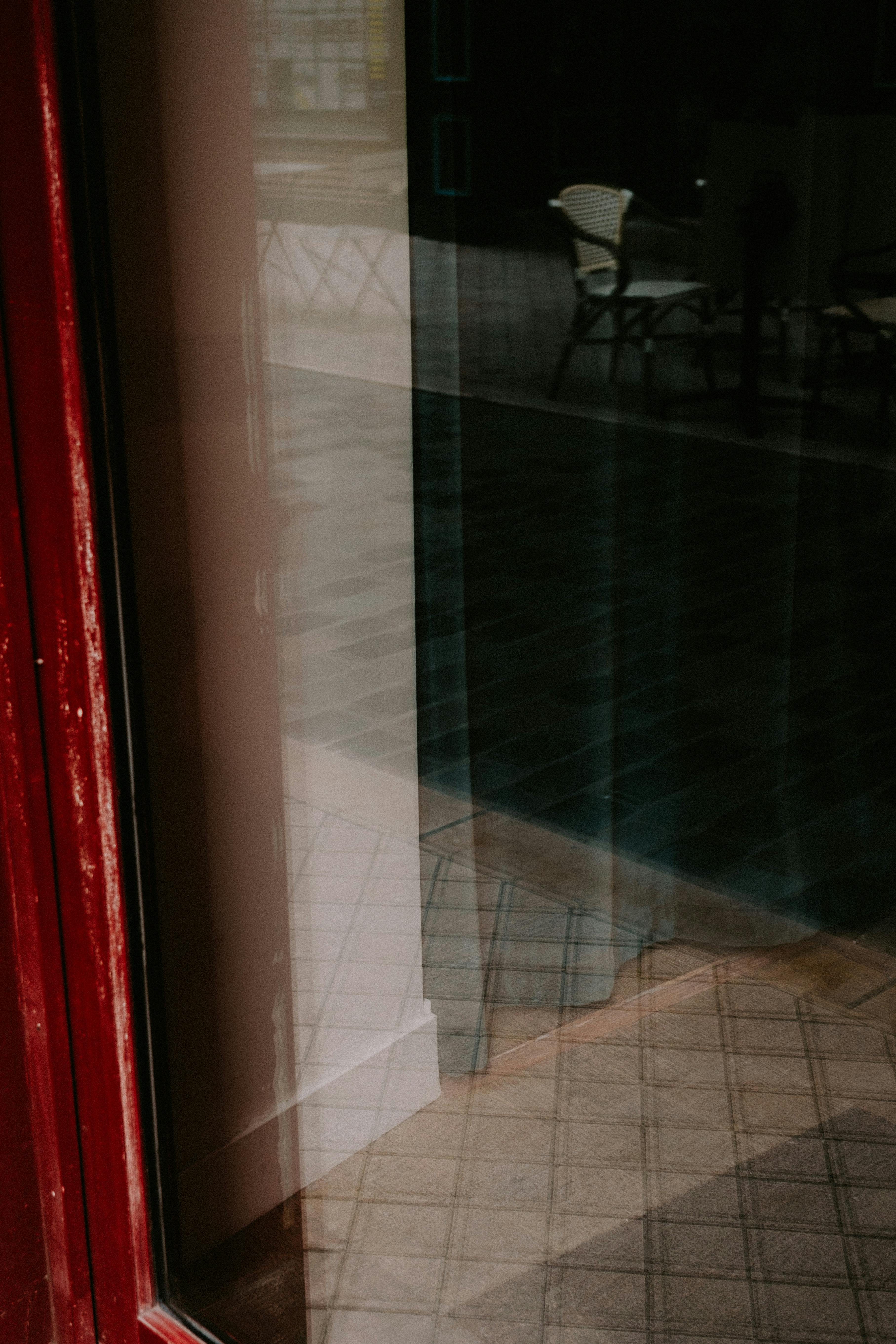 Open Art Book Lying Behind a Shop Window · Free Stock Photo