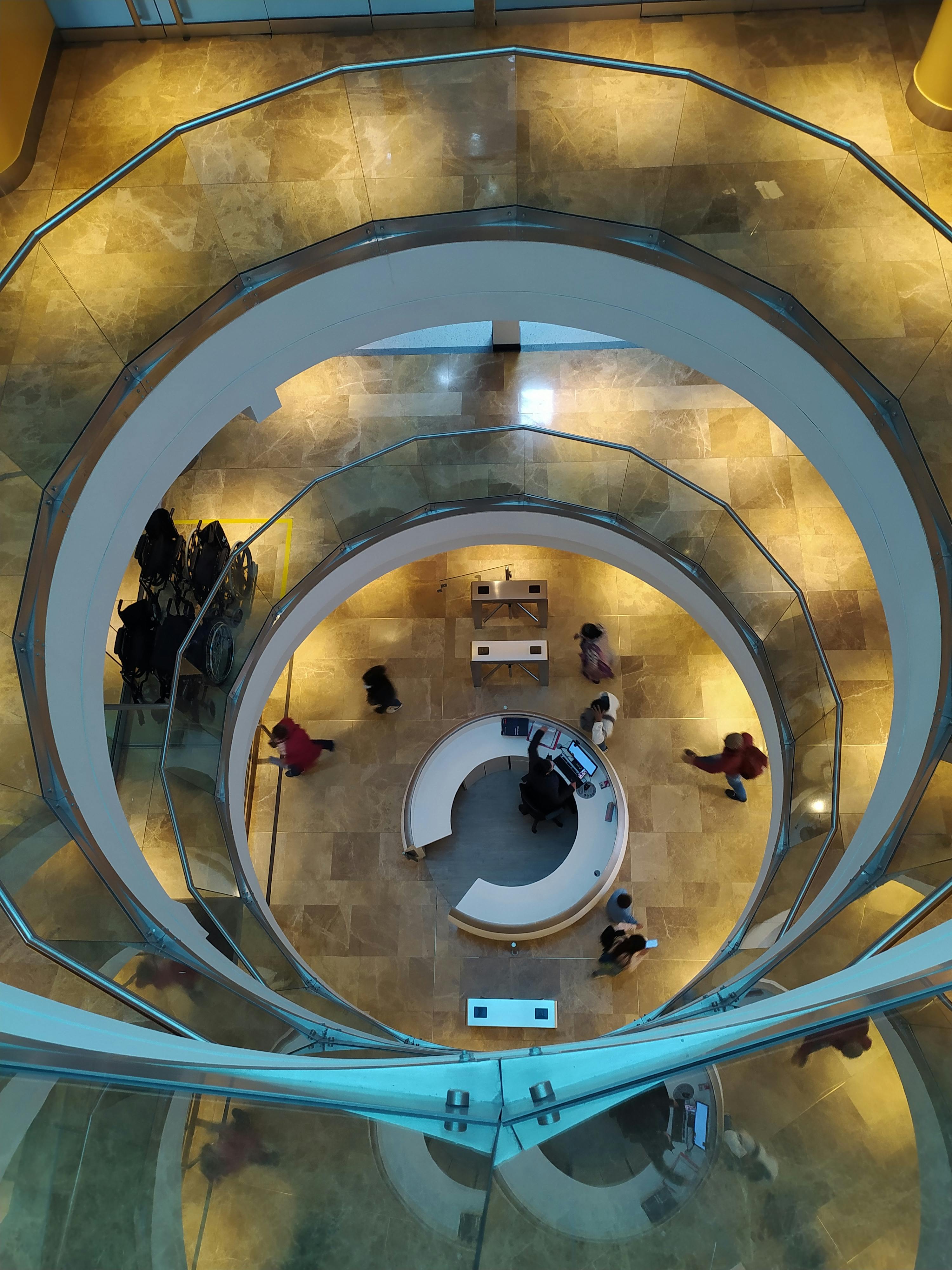 People Walking Inside Glass Building · Free Stock Photo