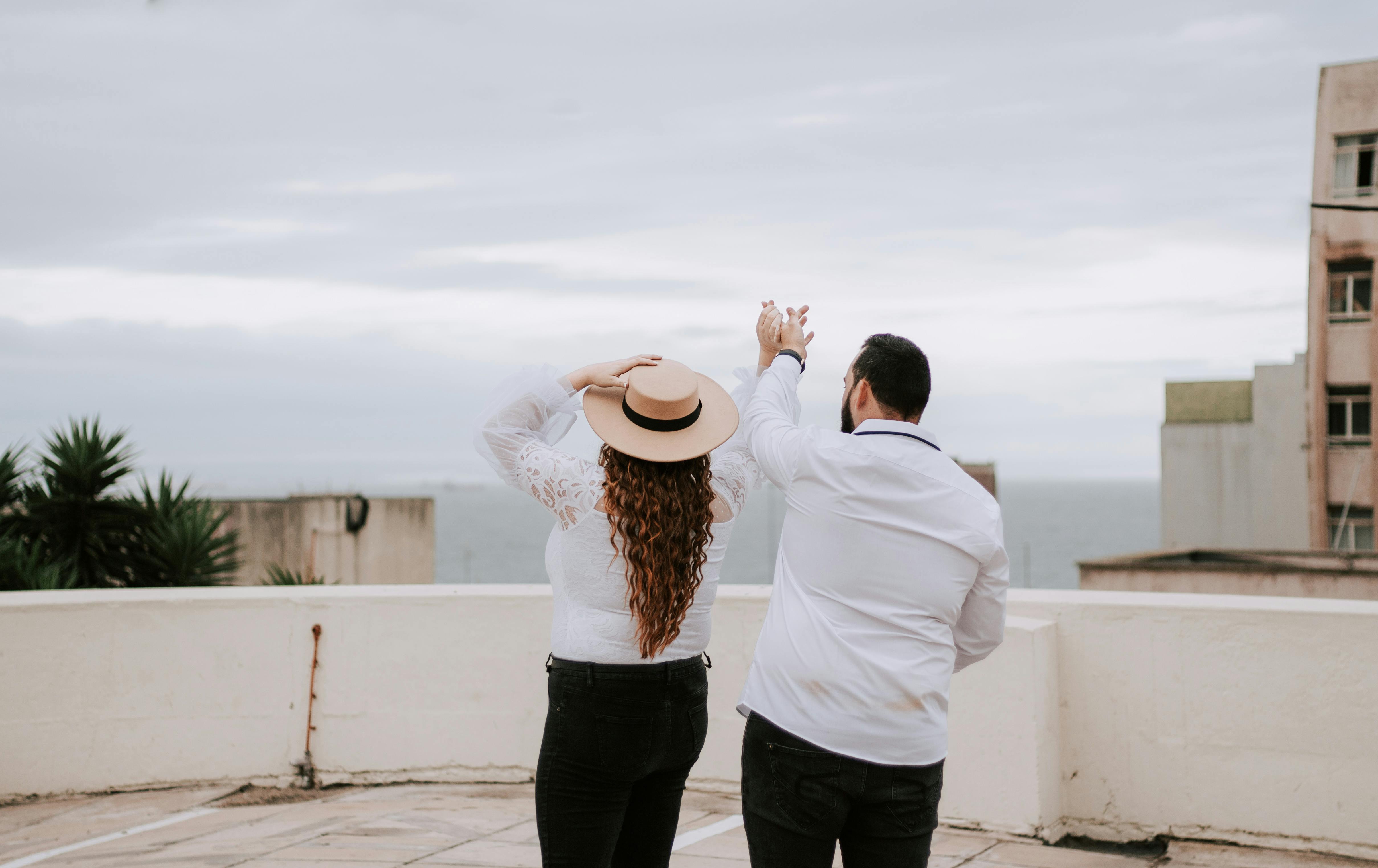 Couple Hugging by Building · Free Stock Photo