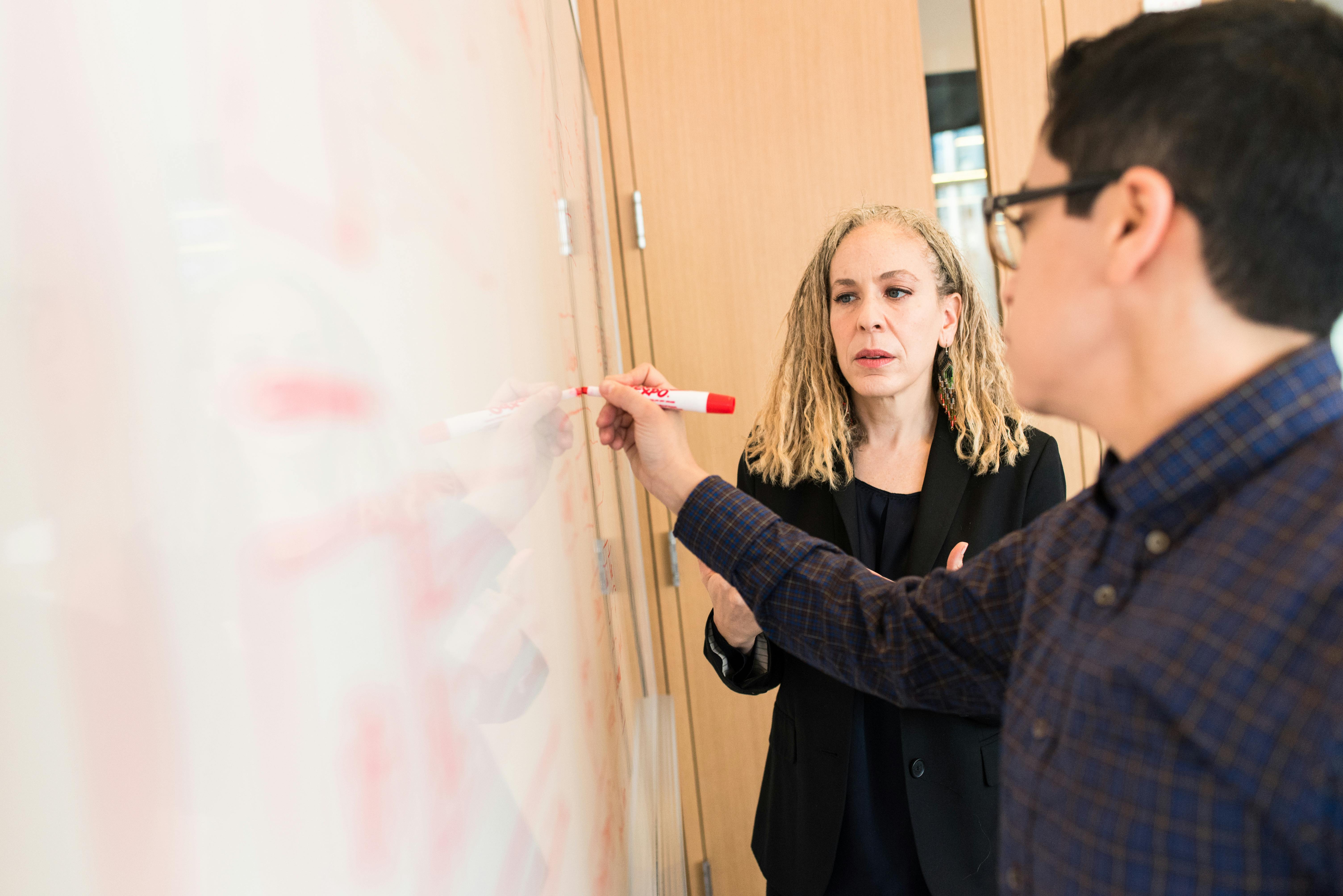 Man Writing On Board · Free Stock Photo