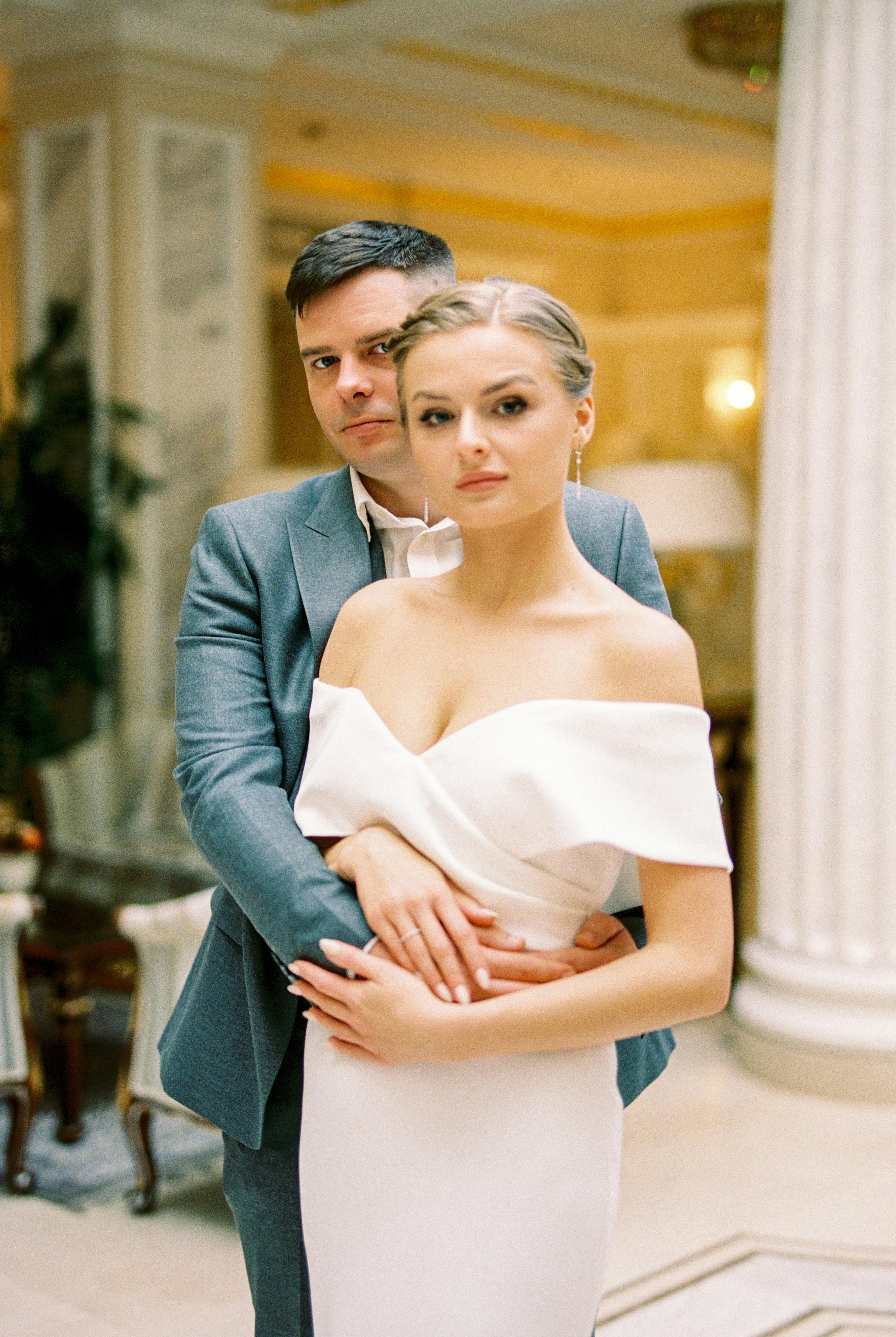 Groom Holding Bride From Behind · Free Stock Photo