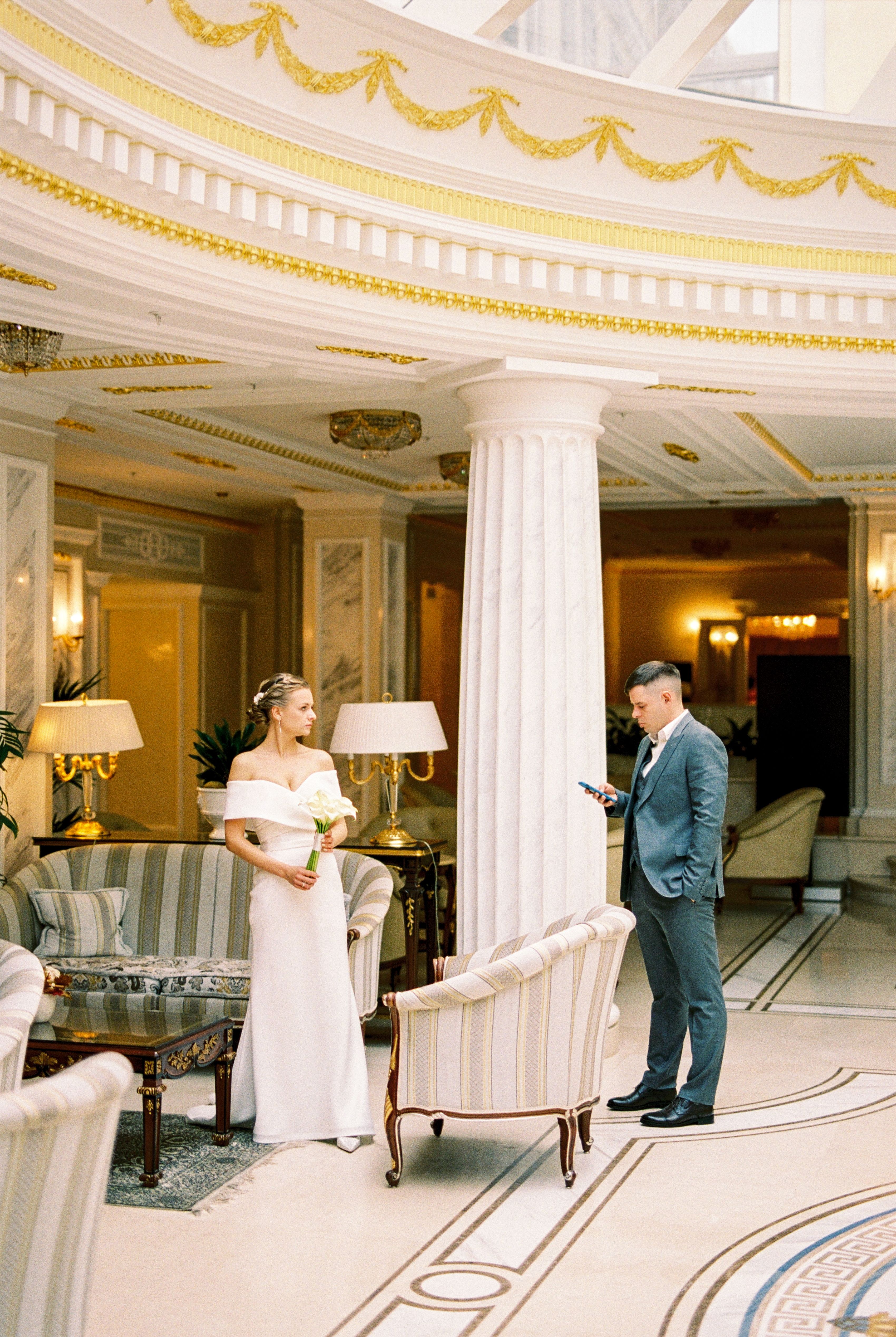 Couple Standing in the Hotel Lobby · Free Stock Photo