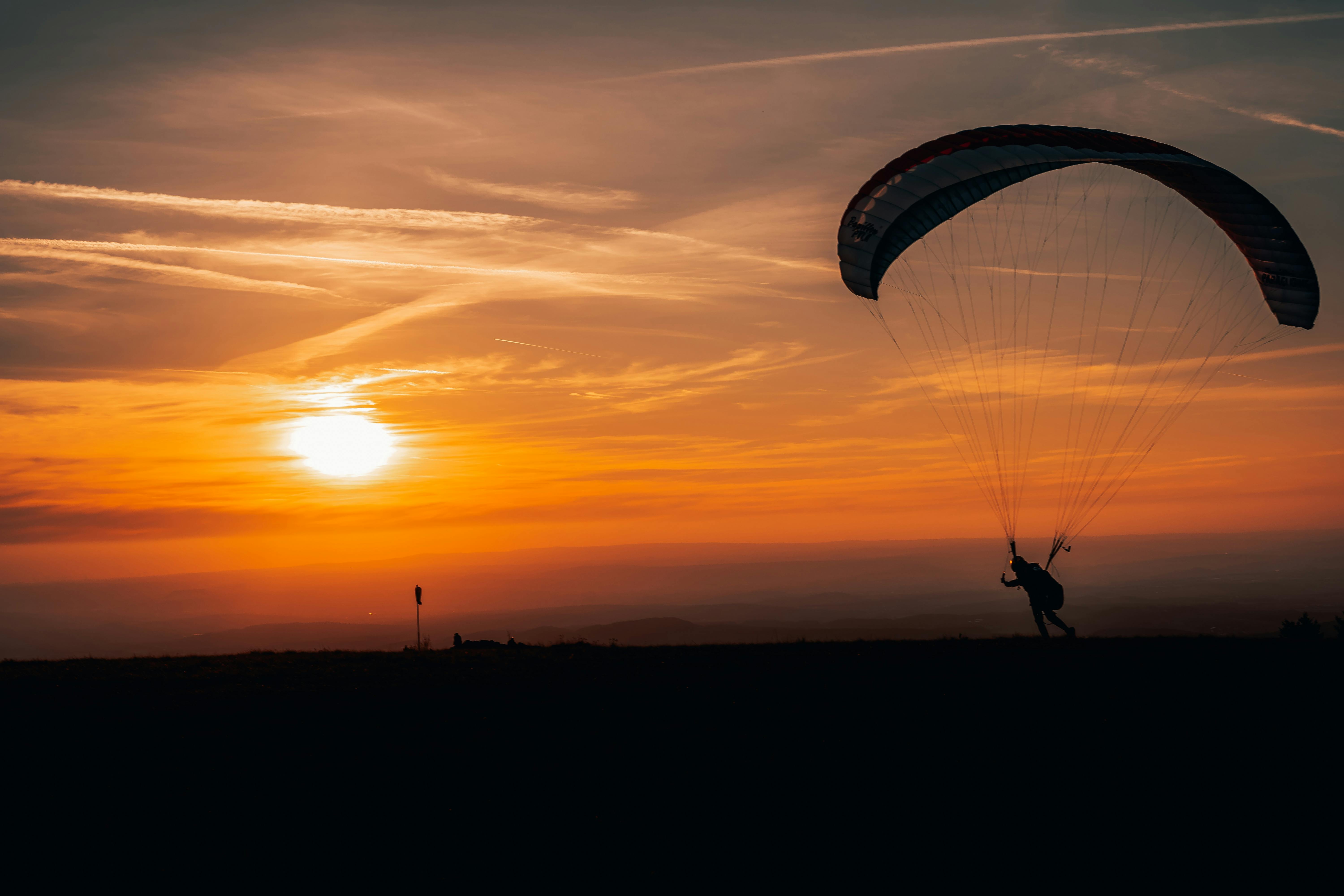 Paraglider in Mid Air During Sunset · Free Stock Photo