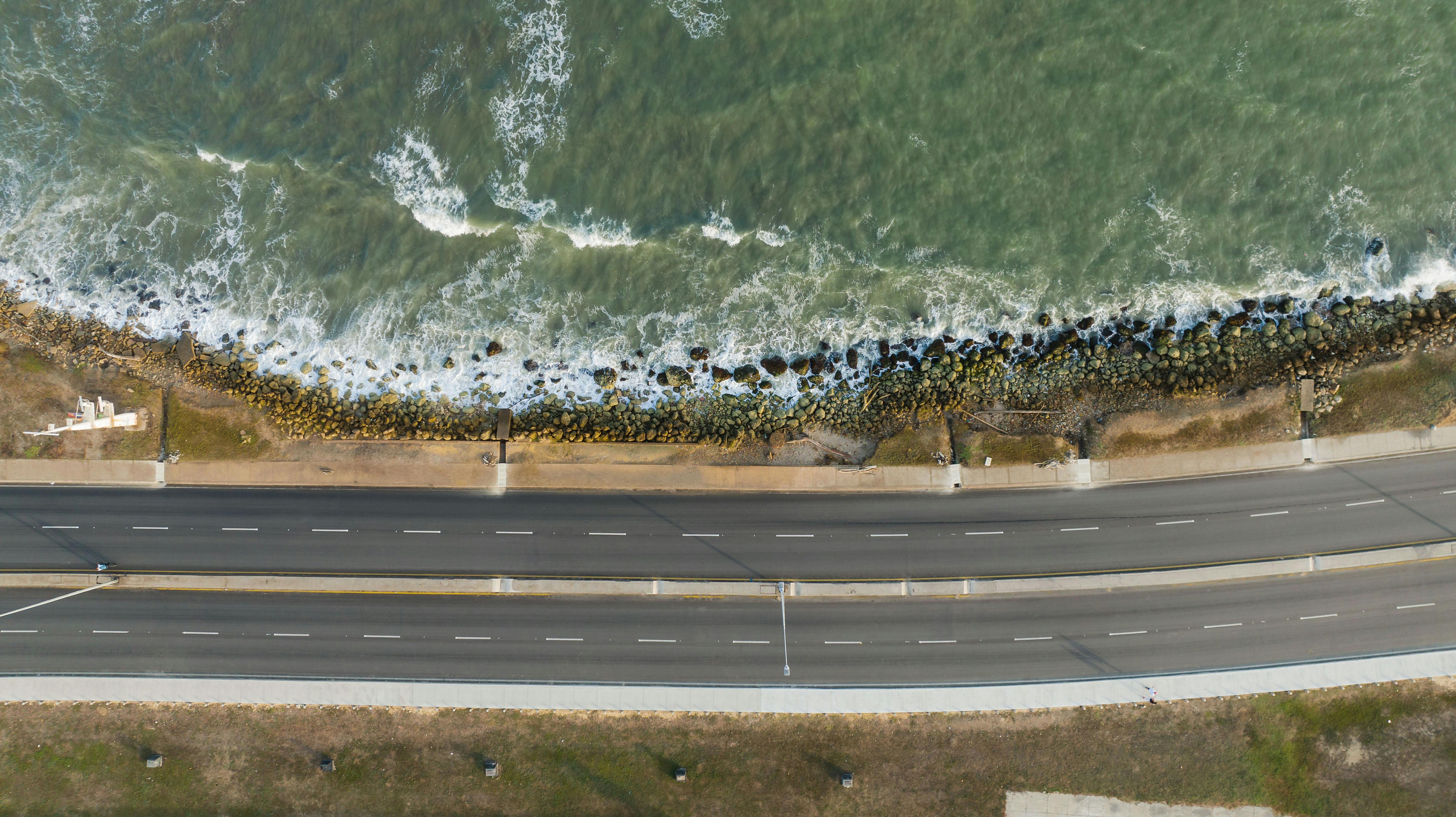 Brids Eye View of a Multiple Lane Road by the Sea · Free Stock Photo