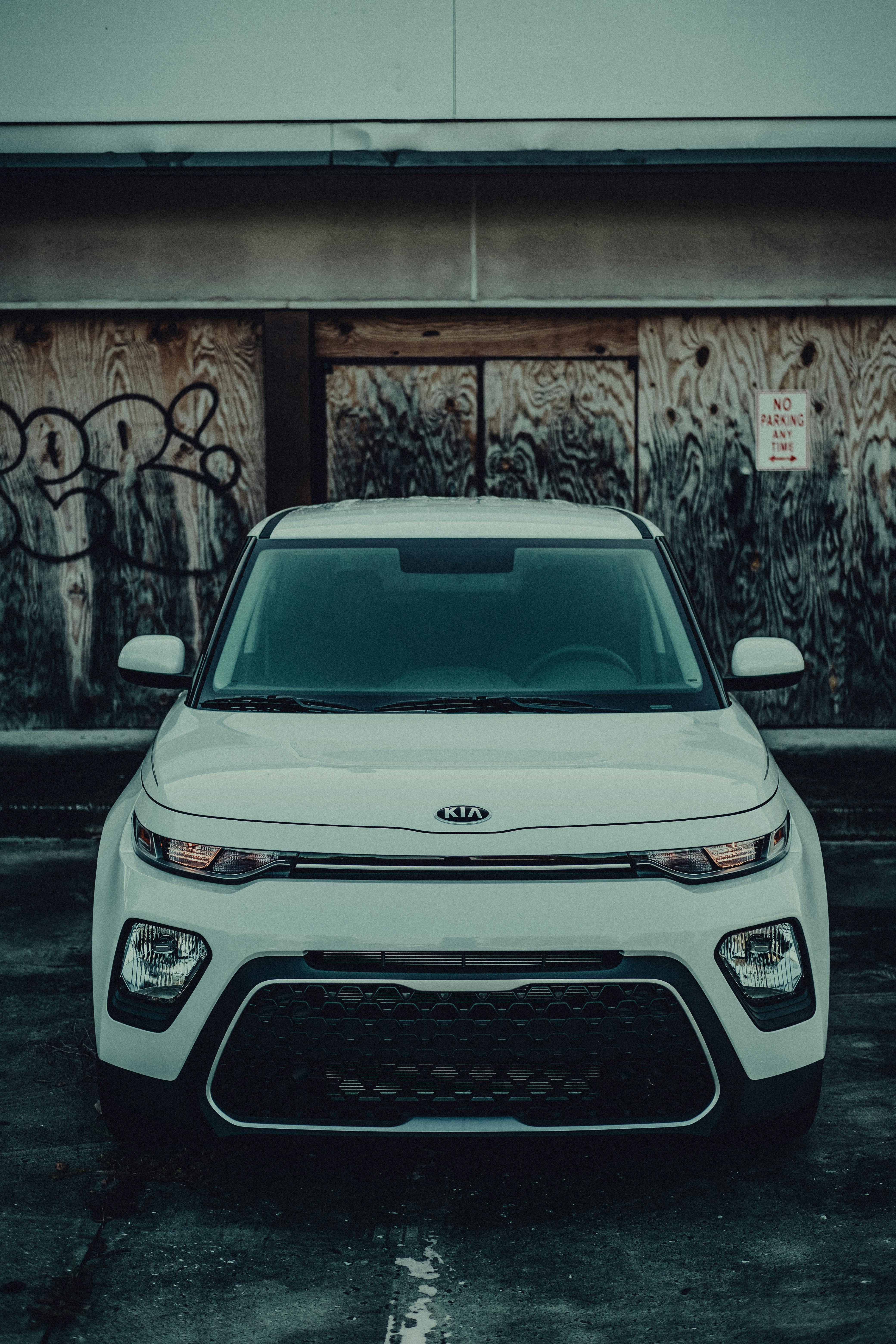 White Kia Car Parked on the Road · Free Stock Photo