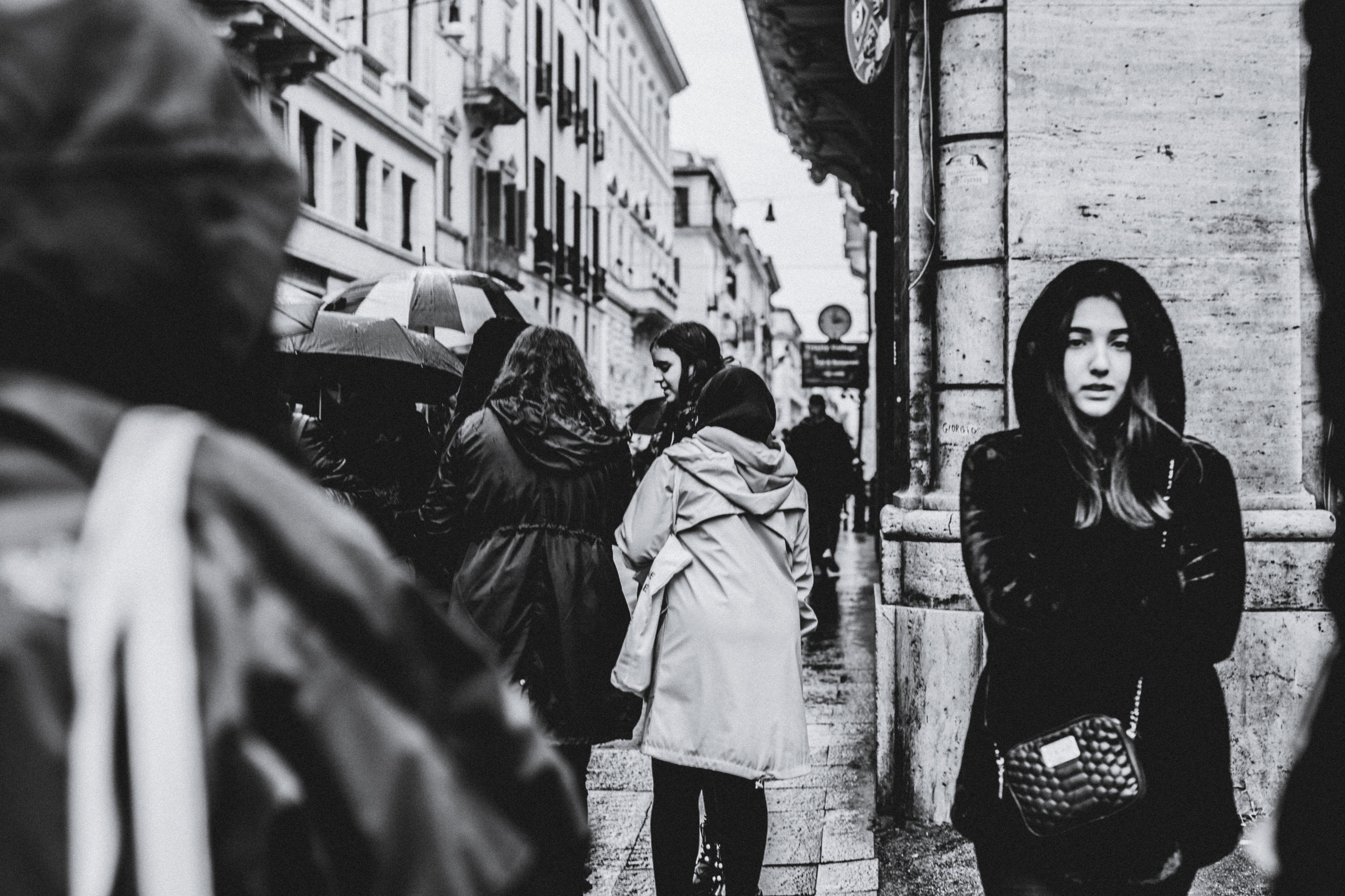 A Grayscale of People on a Street in a City · Free Stock Photo