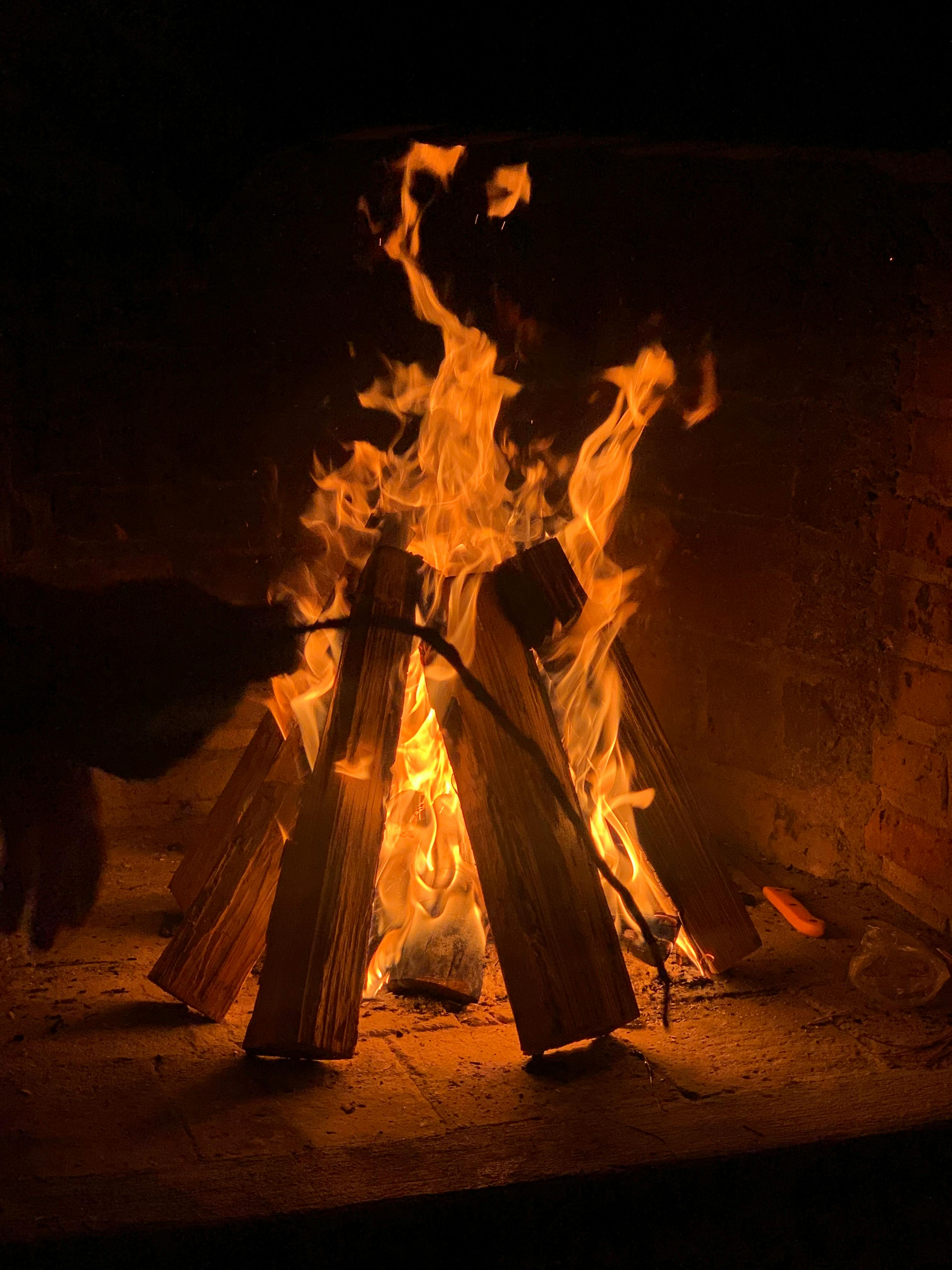 Fire in Front of Brown Brick Wall · Free Stock Photo