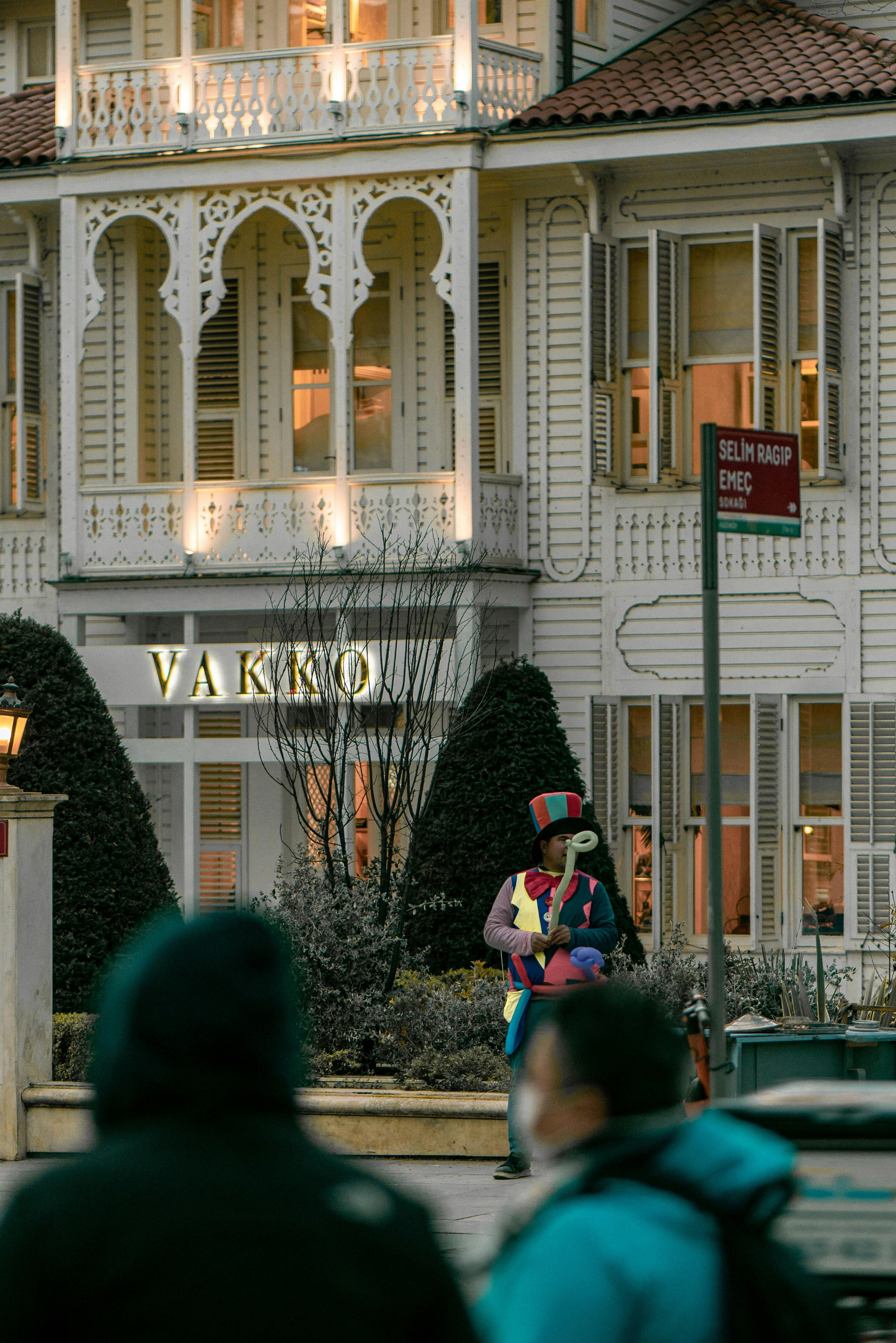 People Walking on Sidewalk Near Building · Free Stock Photo
