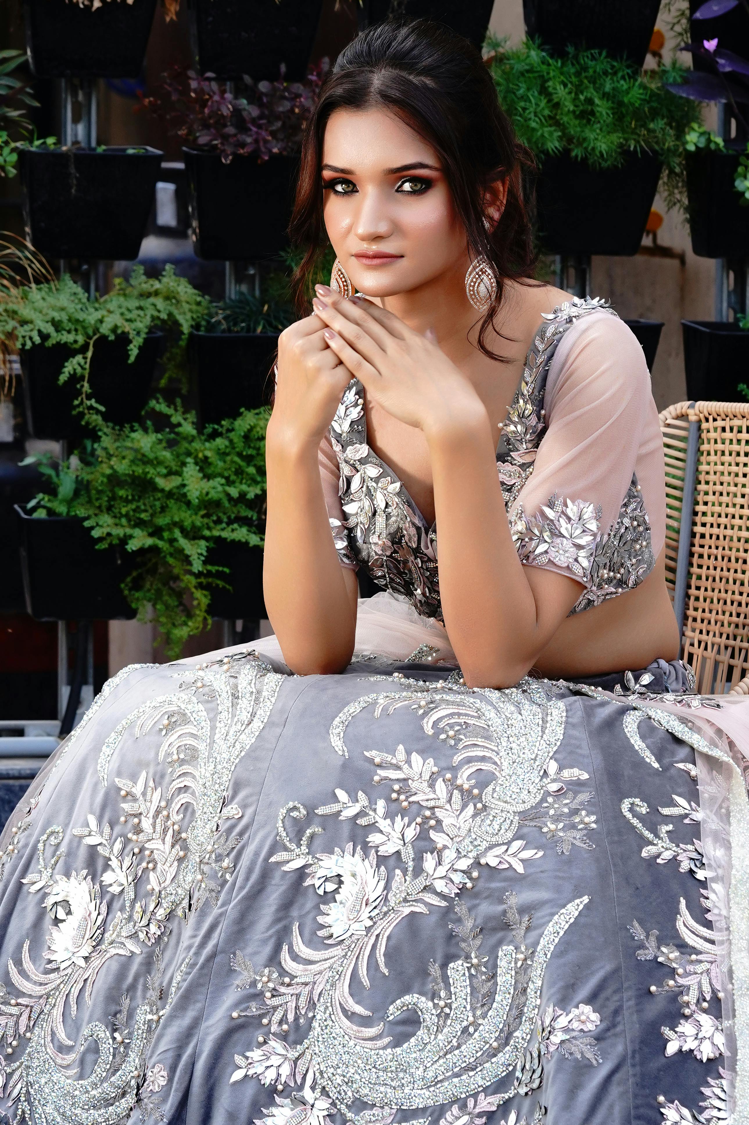 A Pretty Woman in Silver Dress Sitting on the Chair · Free Stock Photo