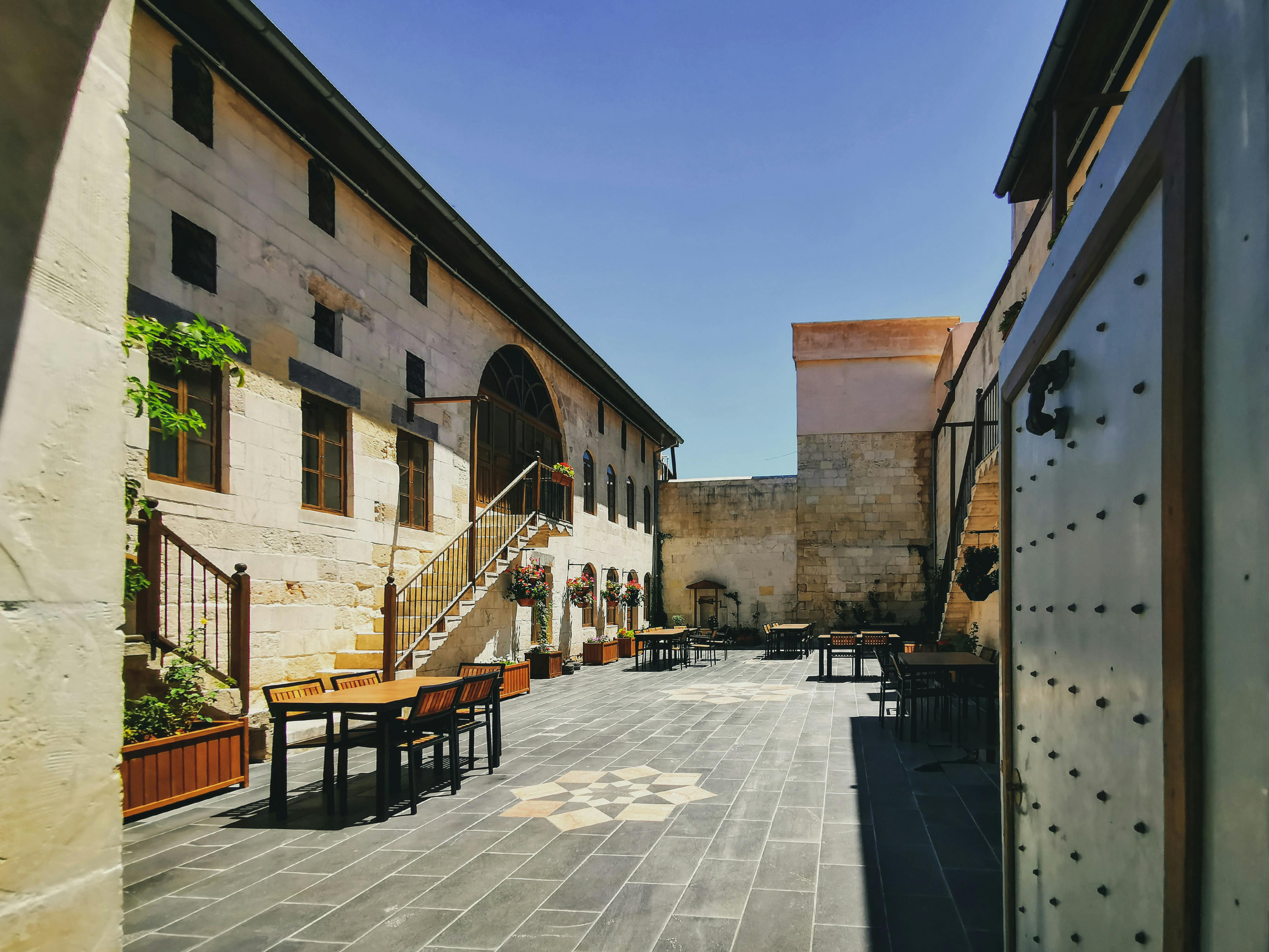 Table and Chairs on the Courtyard · Free Stock Photo