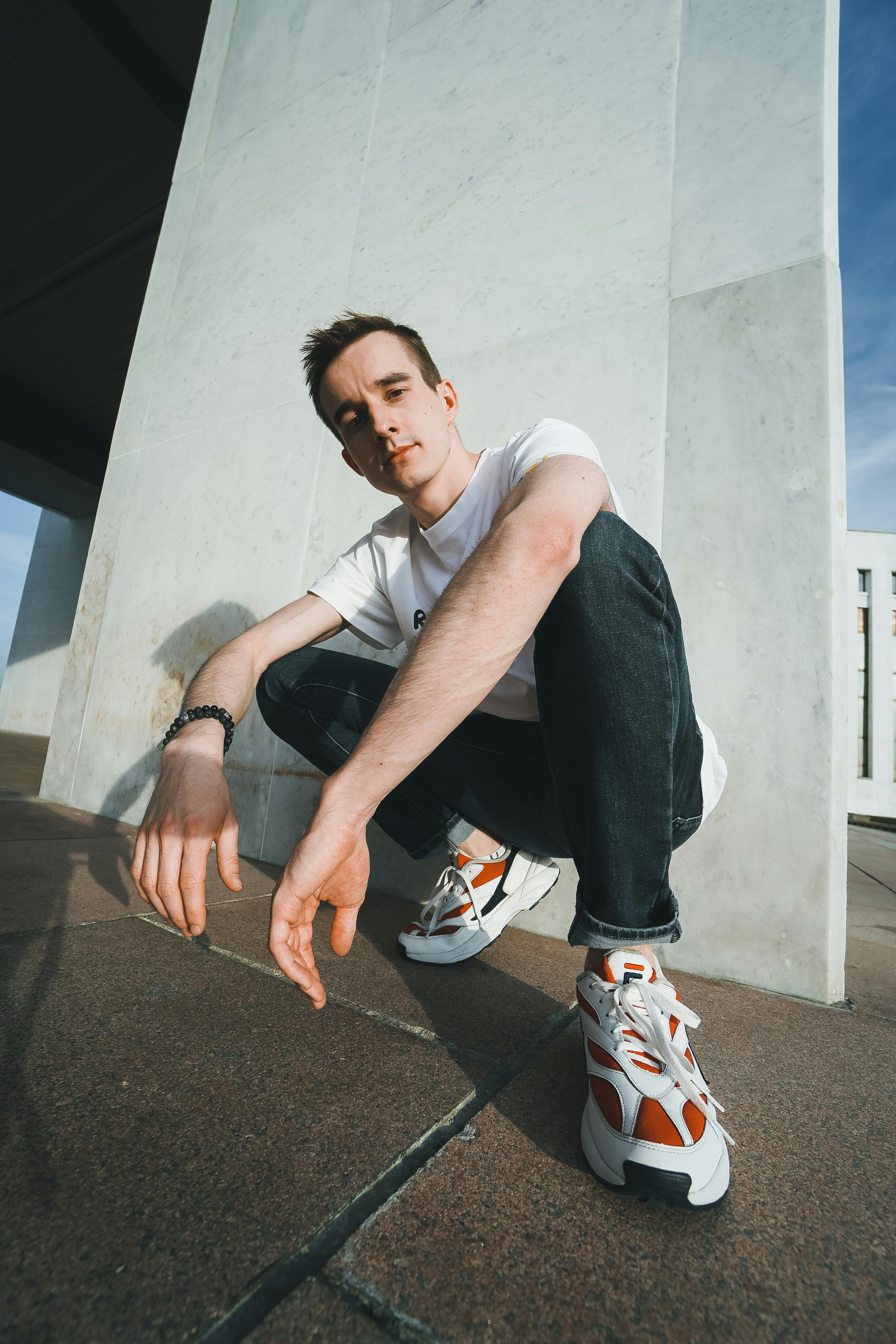 A Man Sitting on Parquet Floor Besides Vintage Television Set · Free ...