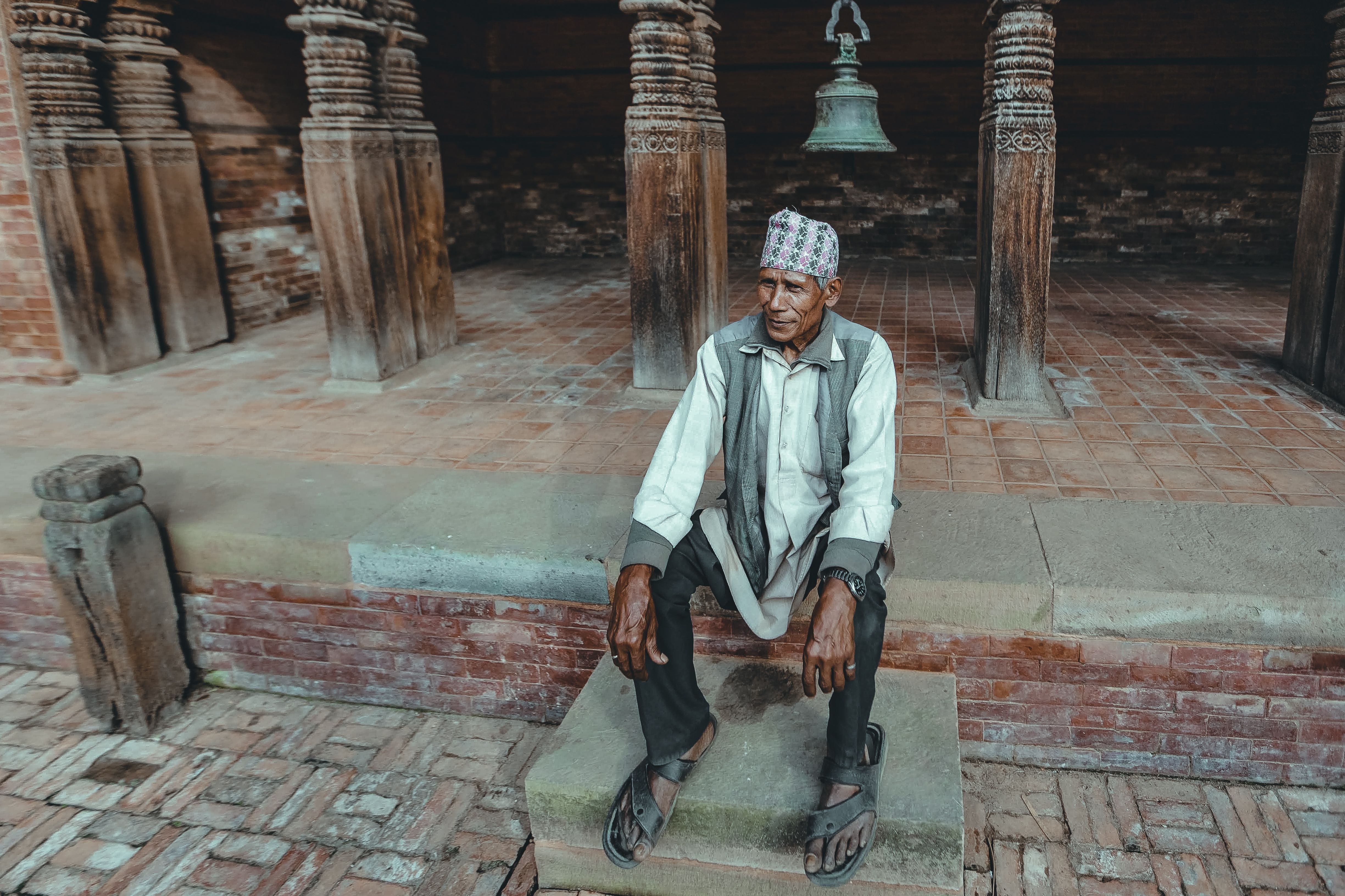 Man Sitting Leaning on Column · Free Stock Photo