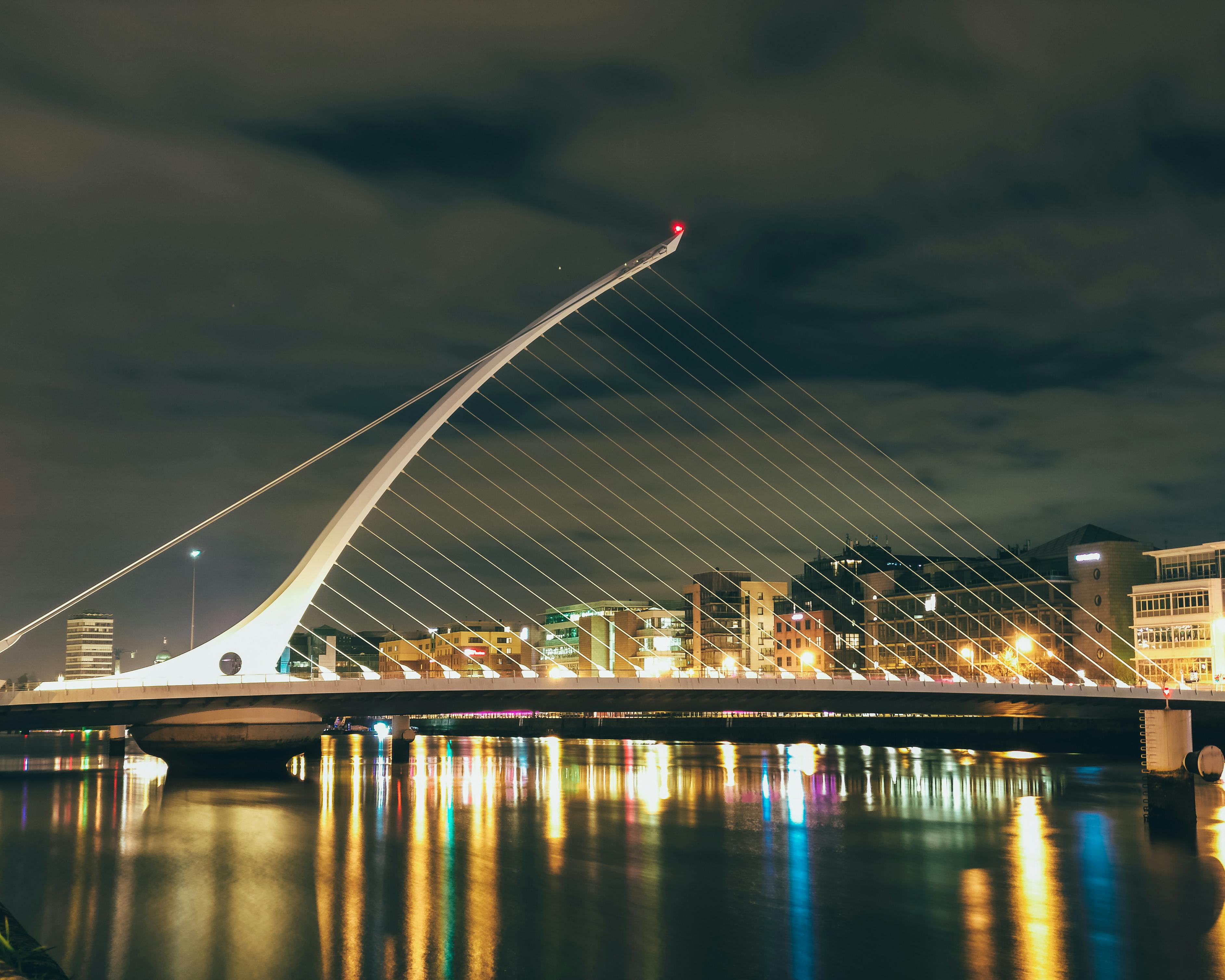 Lighted Bridge over River During Night Time · Free Stock Photo