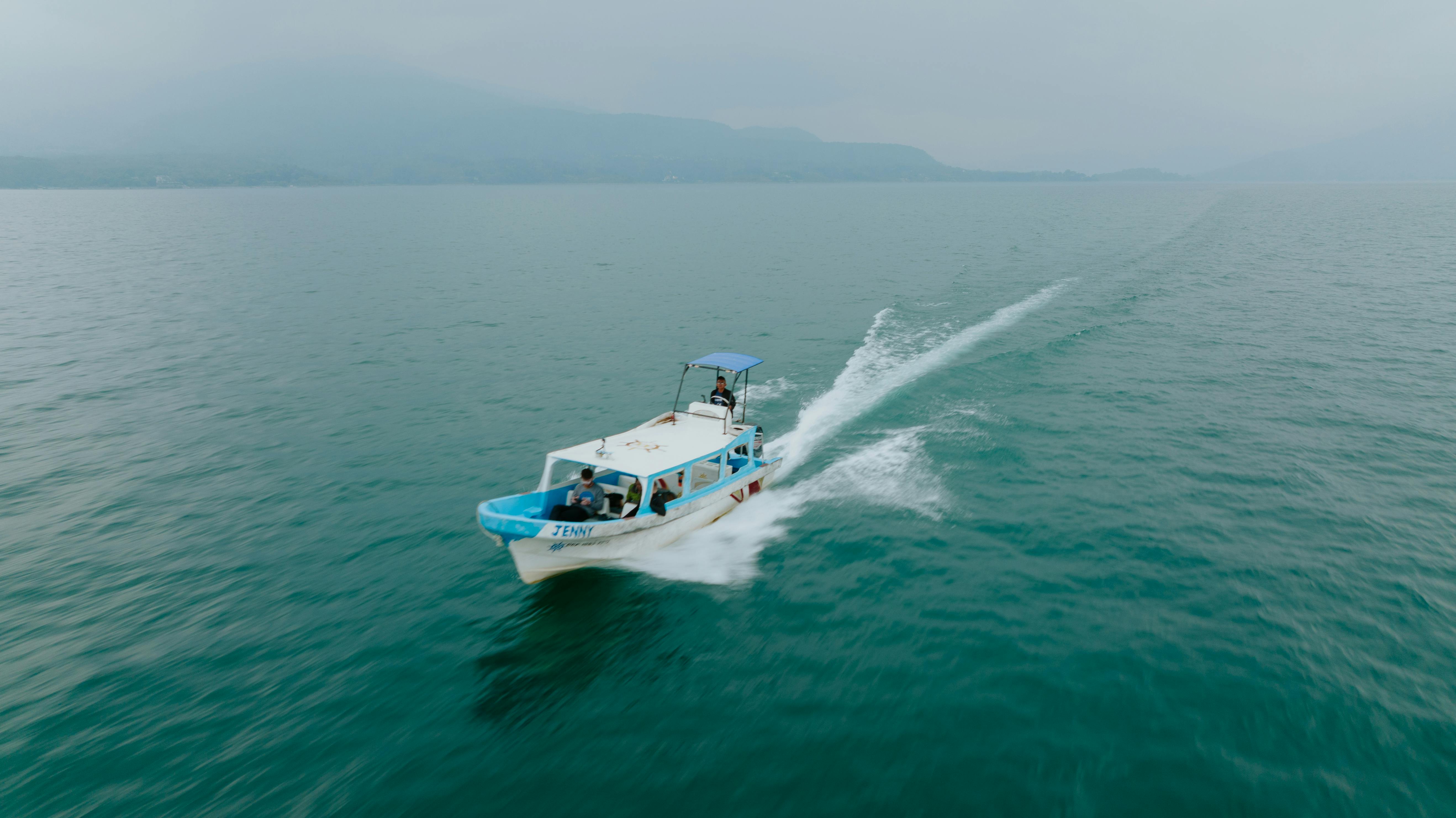 People Riding a Boat on the Lake · Free Stock Photo