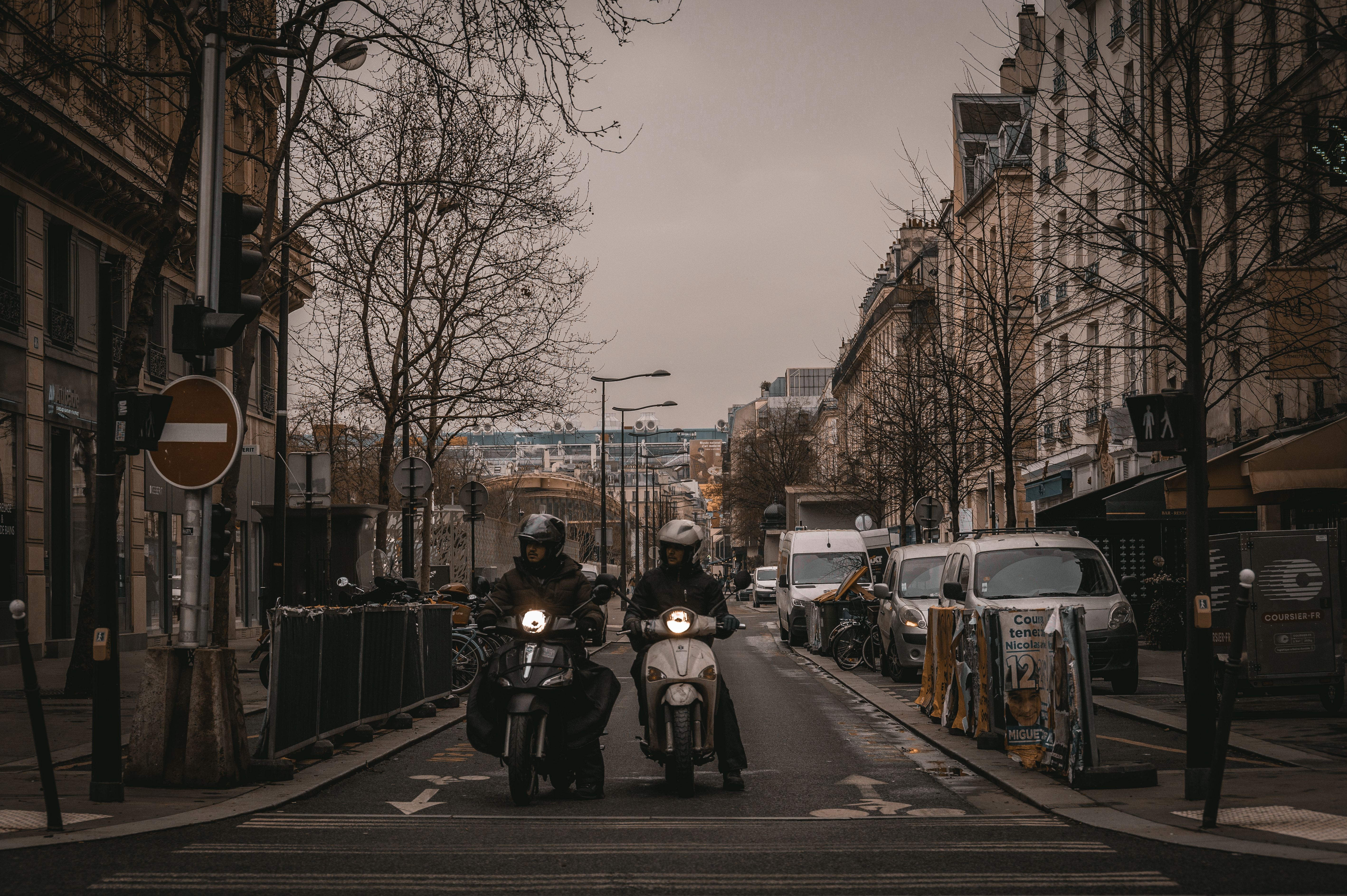 Motorcyclists Stopping on an Intersection · Free Stock Photo