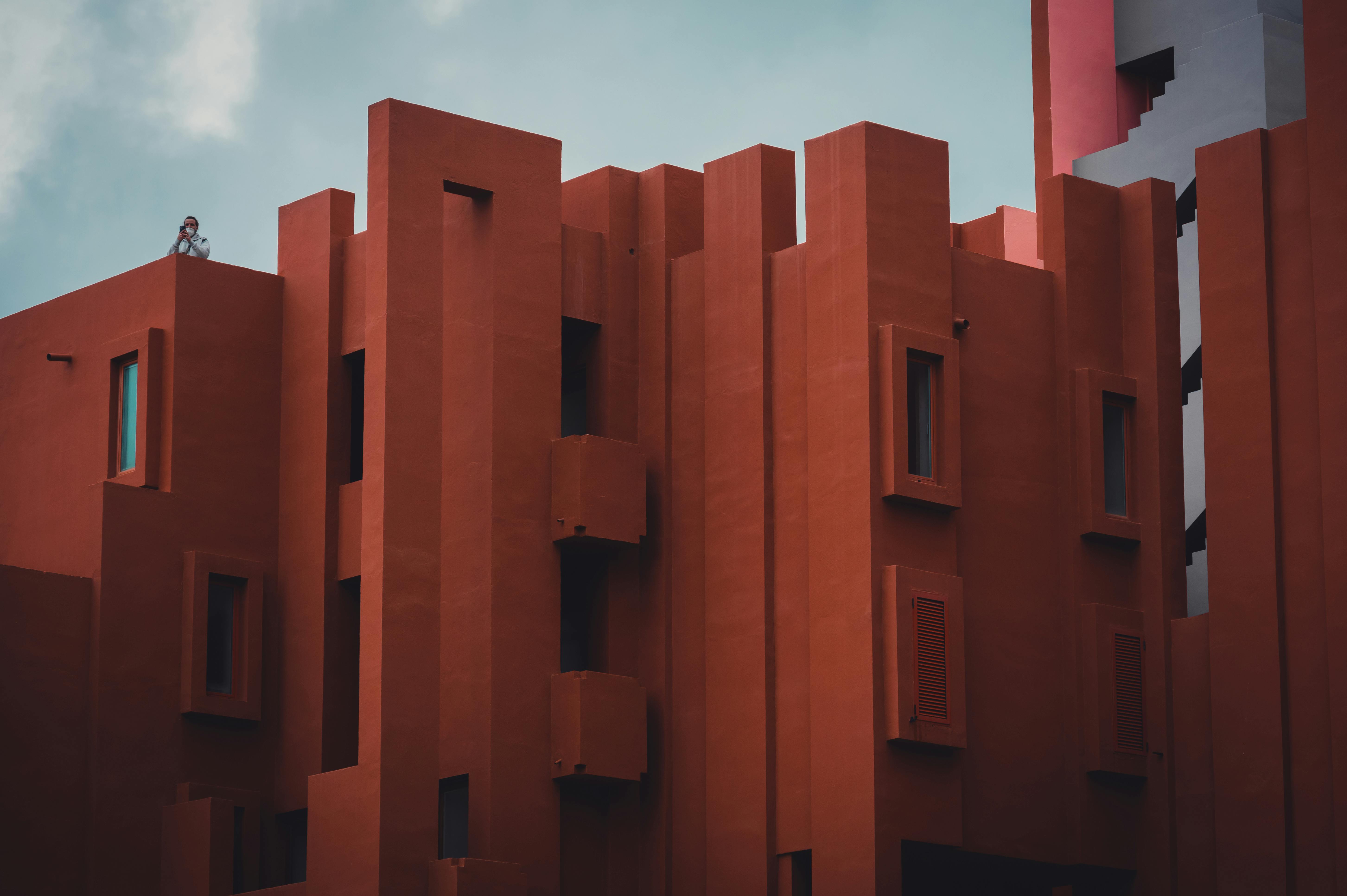 Red Geometric Building on Blue Sky · Free Stock Photo