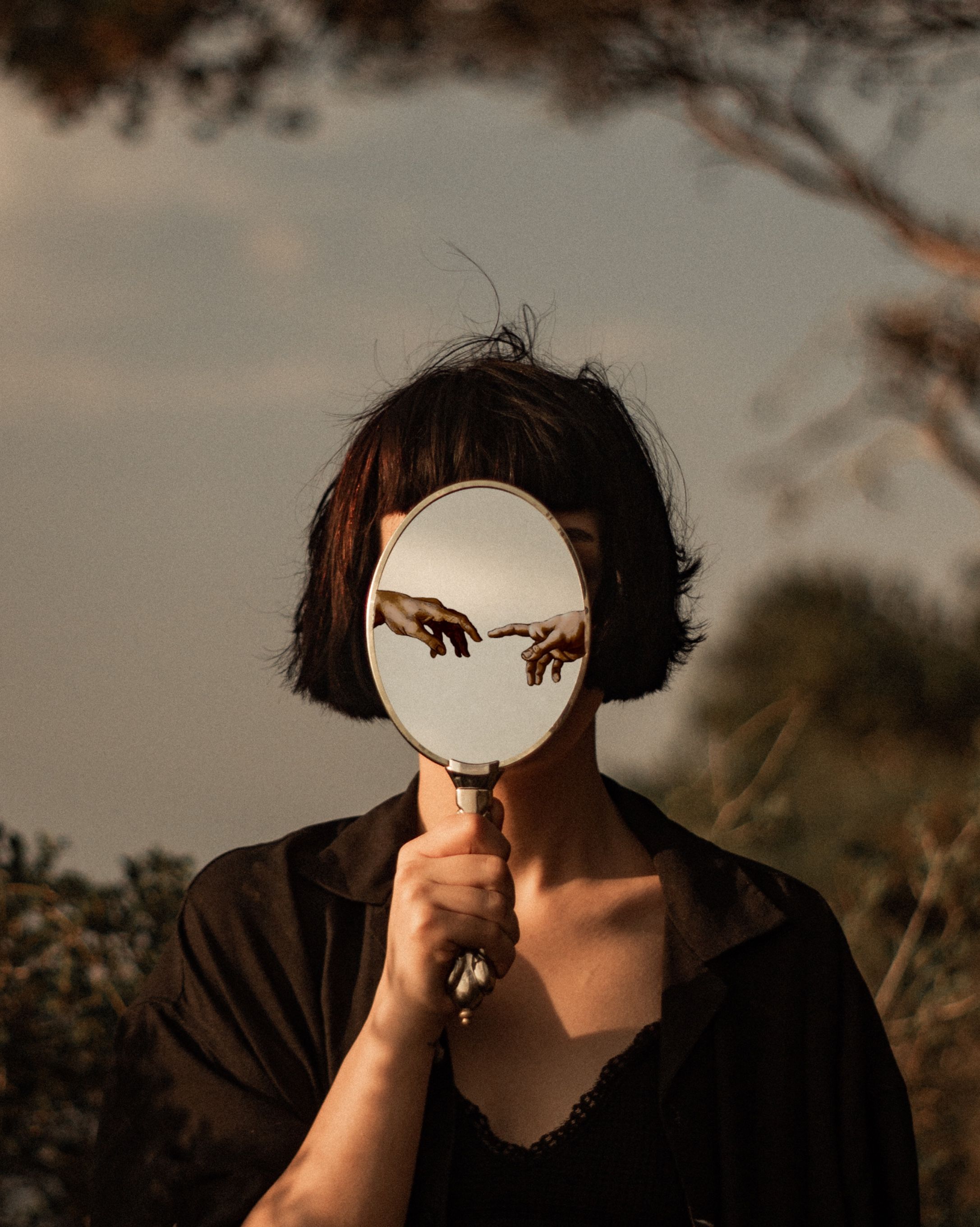 A Person Holding a Mirror · Free Stock Photo