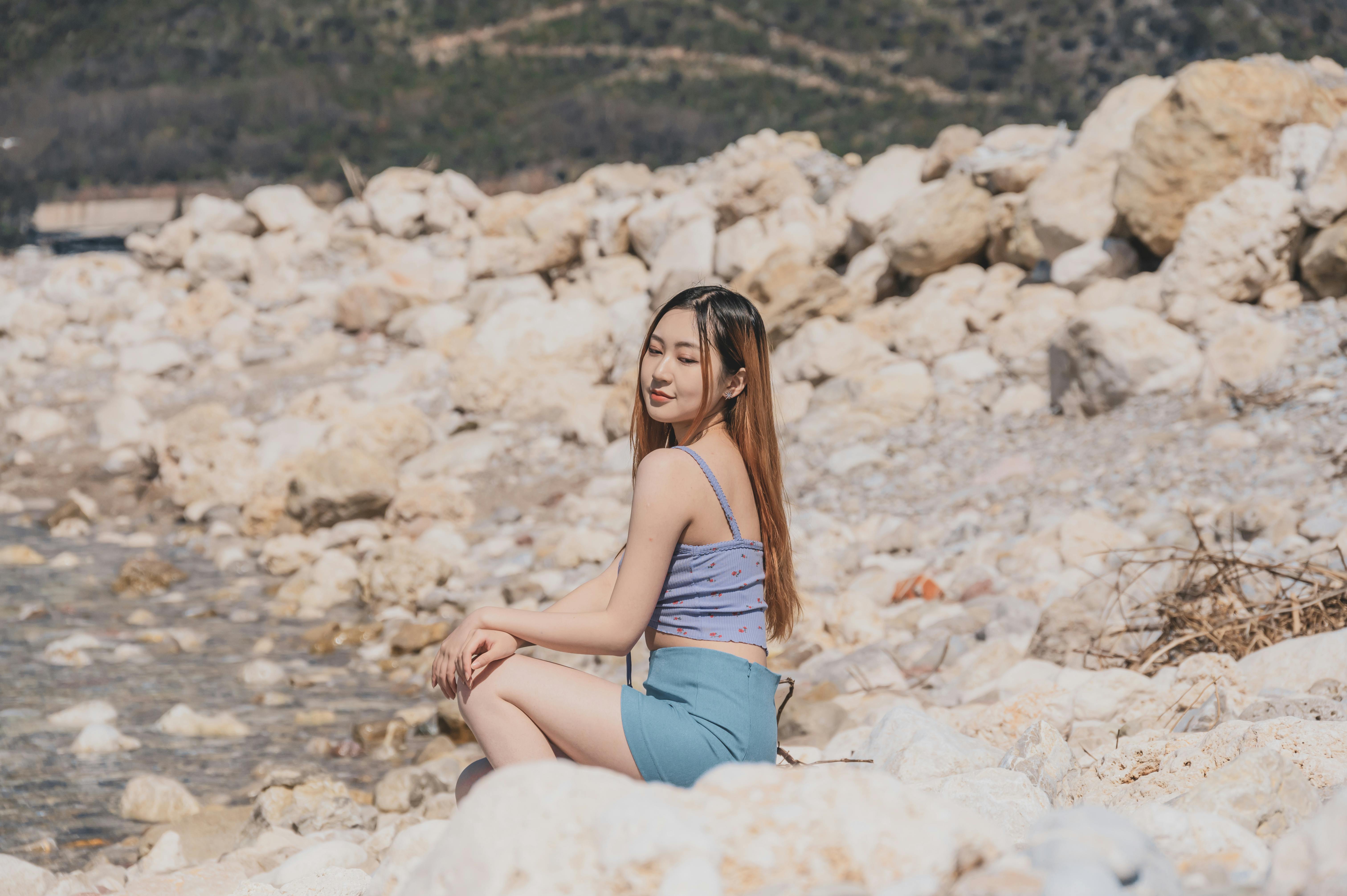 Woman Posing on Chair in Colorful Lights · Free Stock Photo