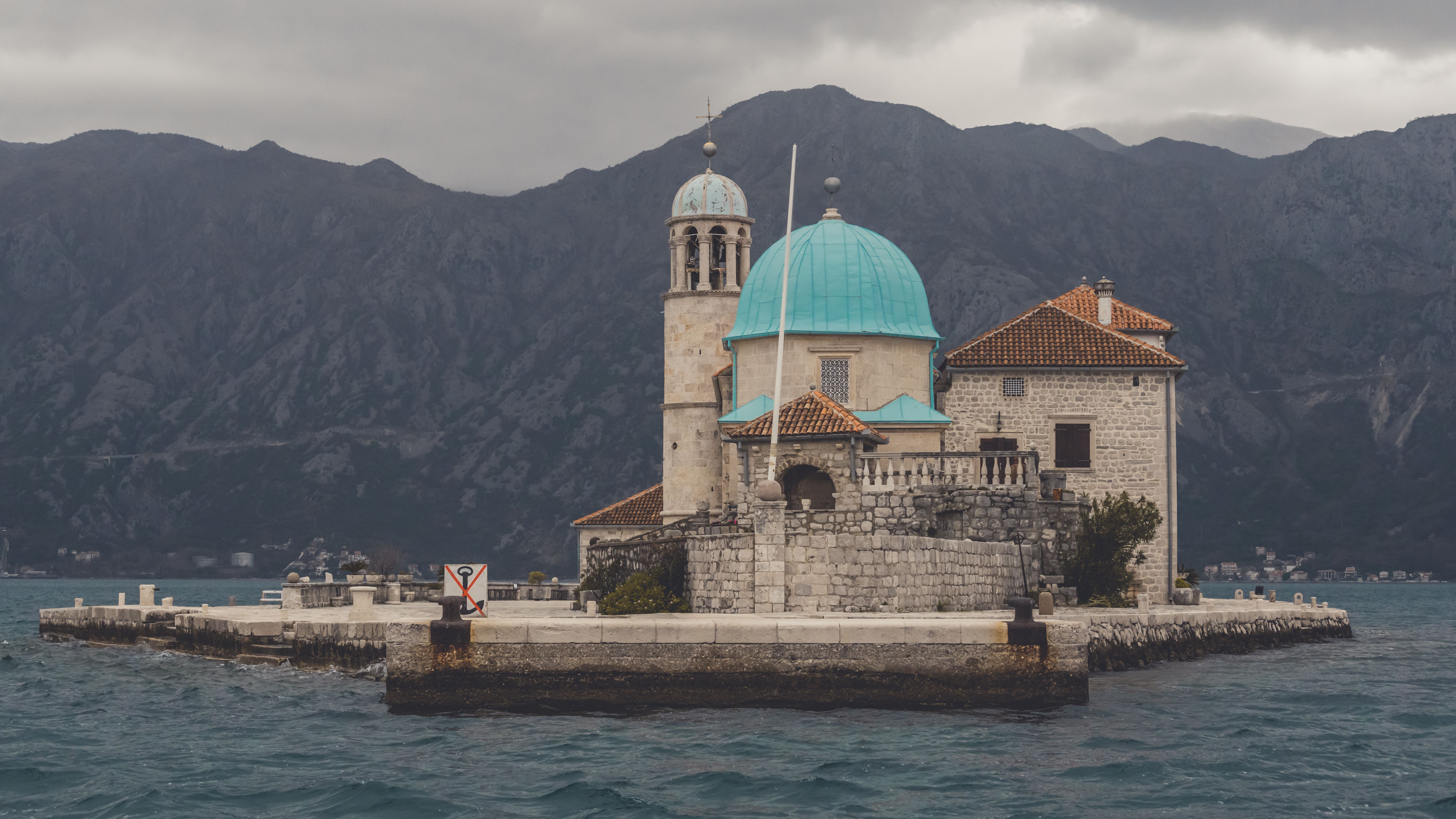 Church on Island with Mountain behind · Free Stock Photo