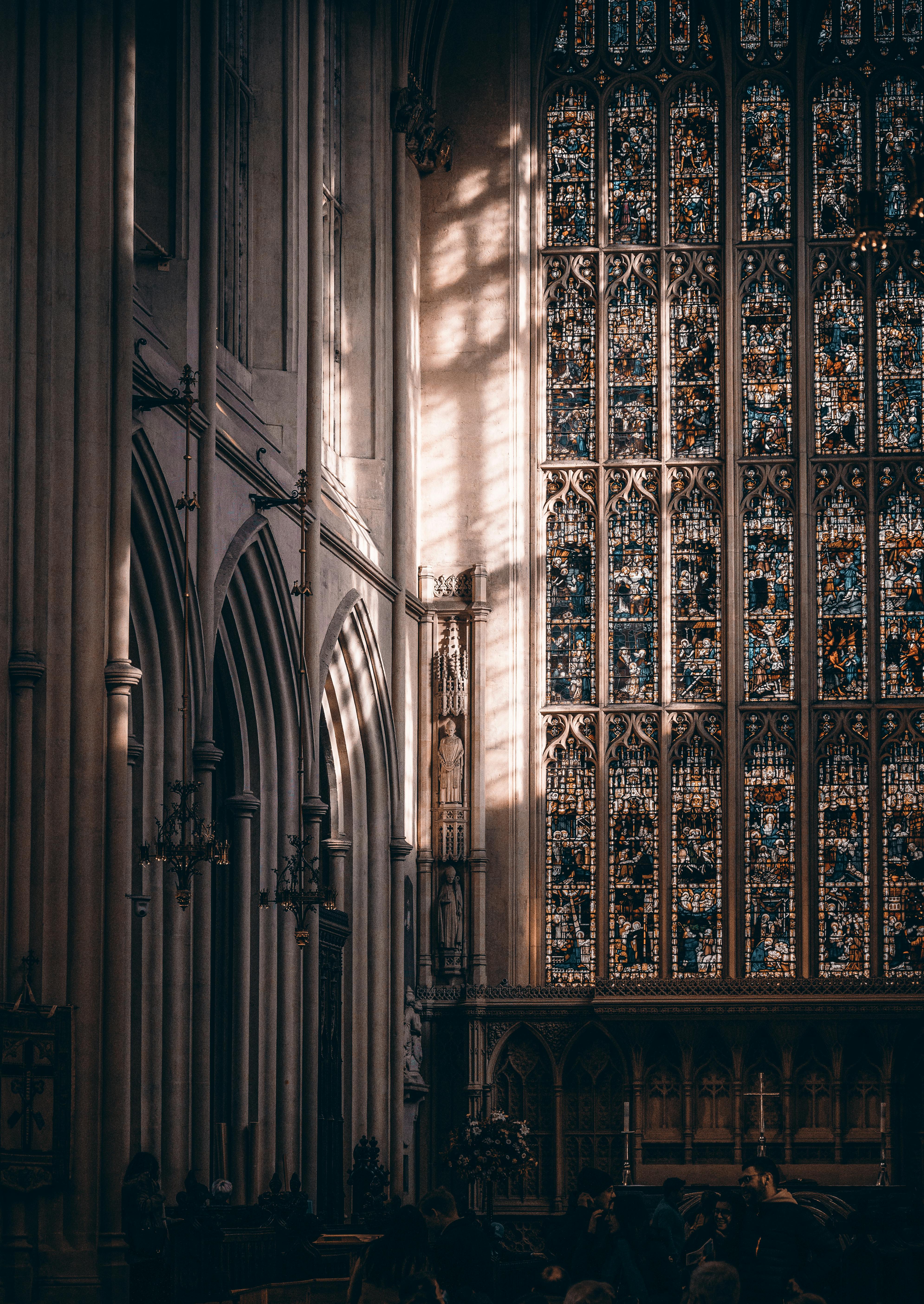 Interior of Gloucester Cathedral Illuminated by Sunlight · Free Stock Photo