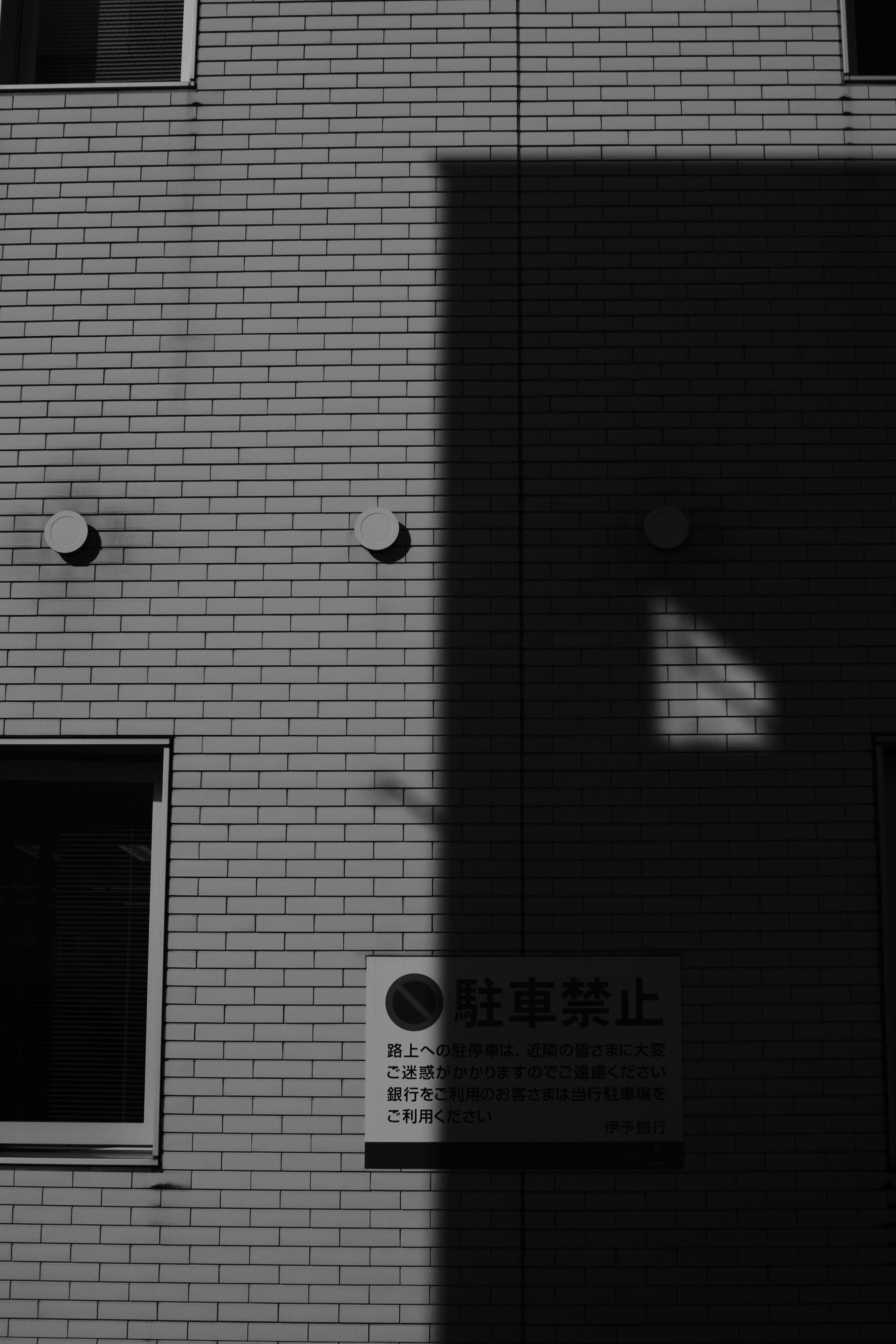 Grayscale Photo of a Brick Building · Free Stock Photo