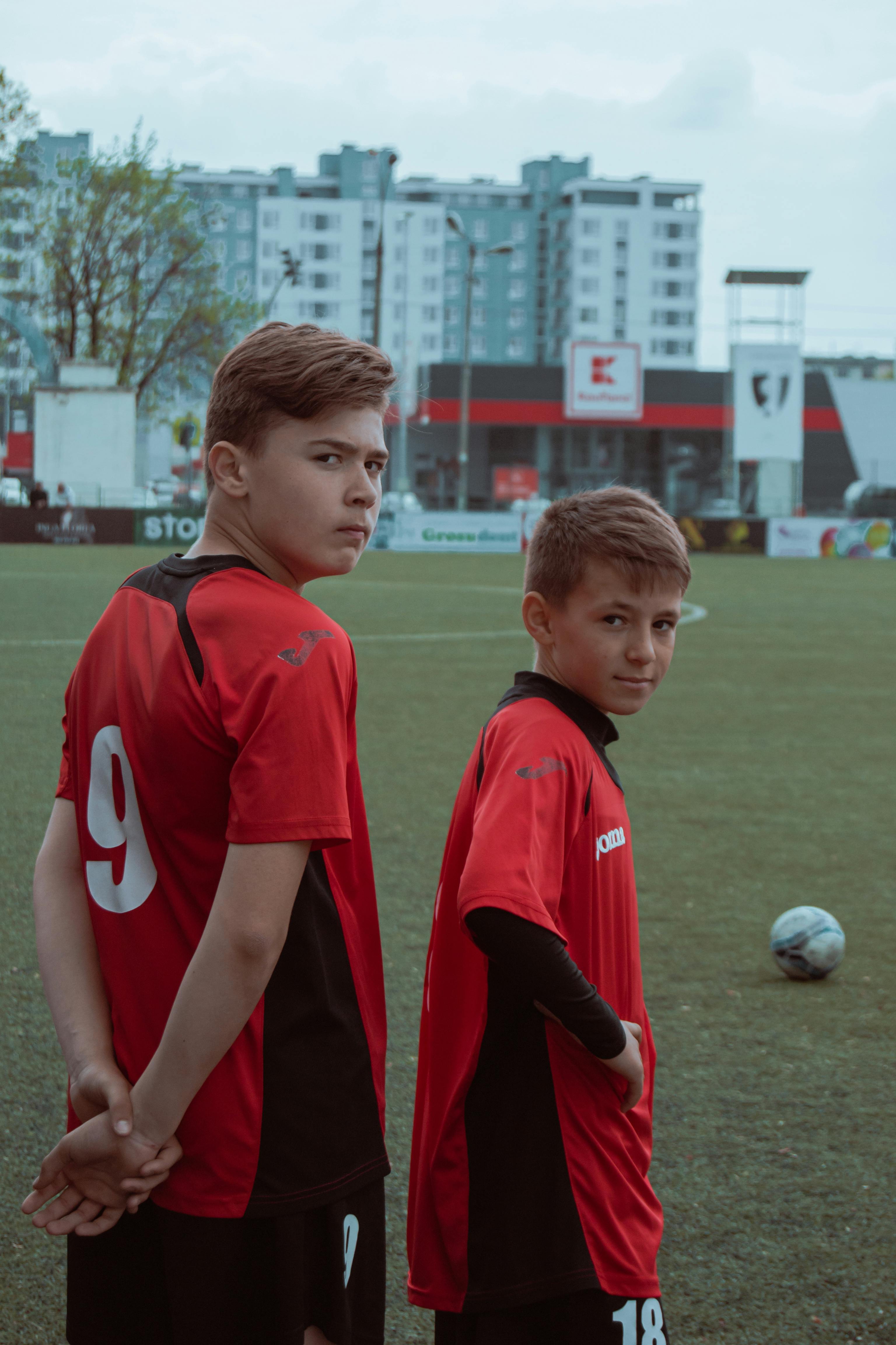 Boys in the Football Field · Free Stock Photo