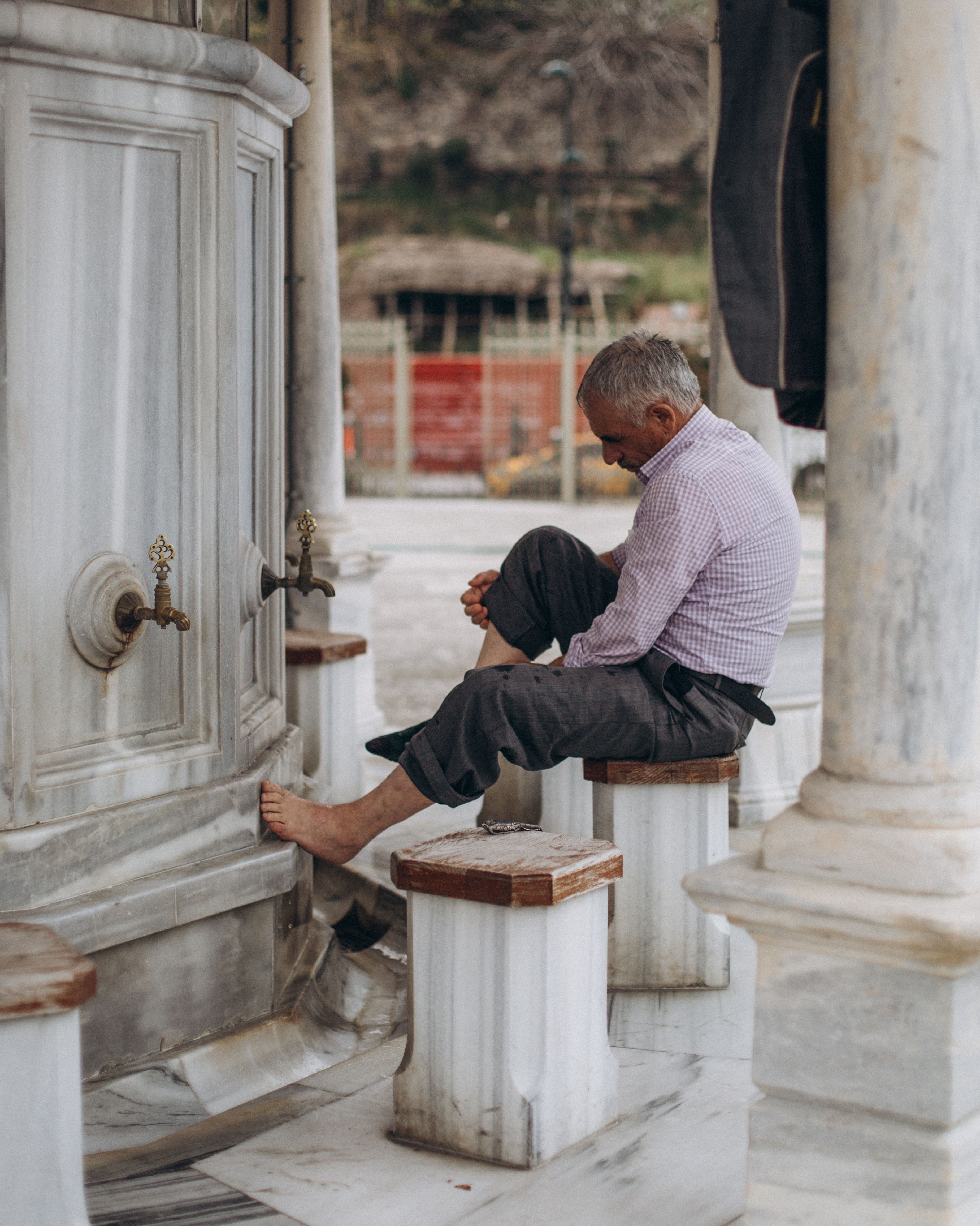 A Man Sitting on the Street · Free Stock Photo